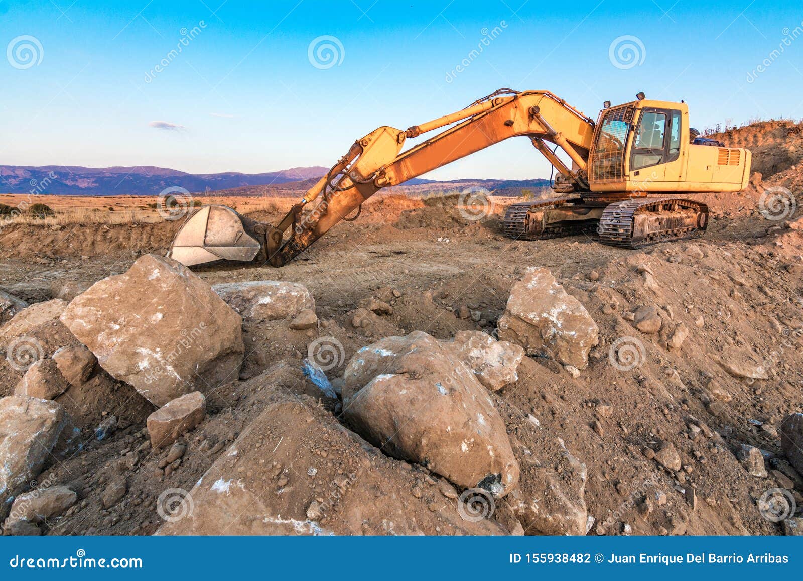 A Large Orange Excavator Moving Stone in a Quarry Editorial Photography ...