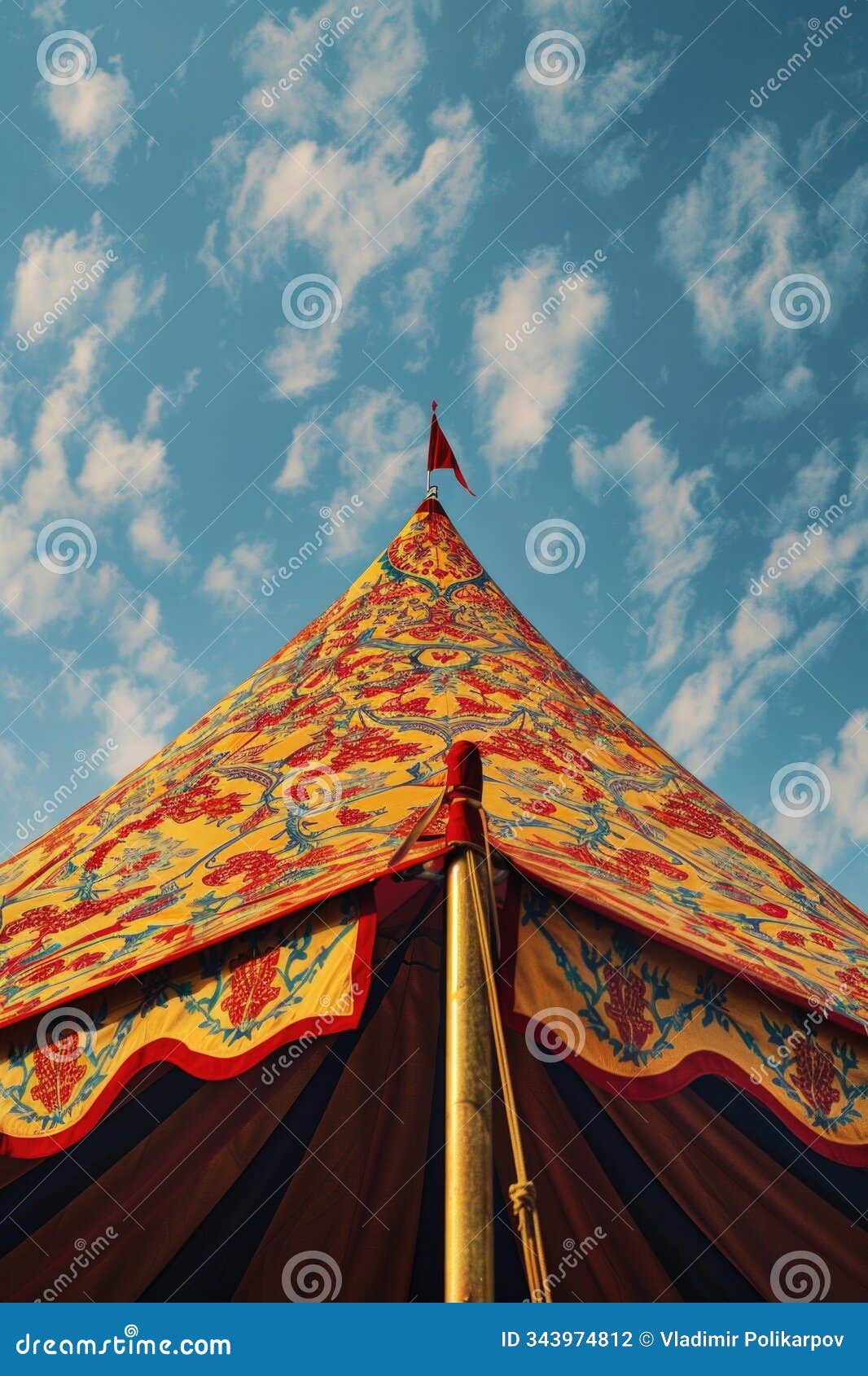 A Large Outdoor Tent with a Flag Flying High Stock Photo - Image of ...