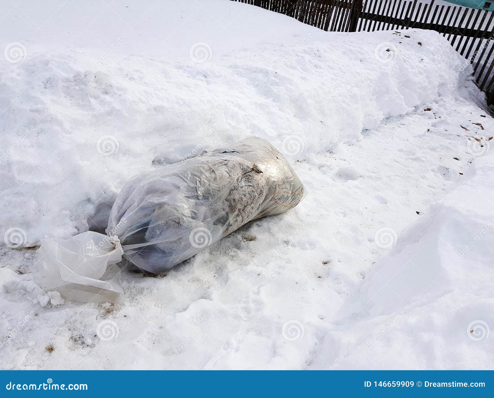A Large Package of Garbage Lies Right on the Road Against the Backdrop ...