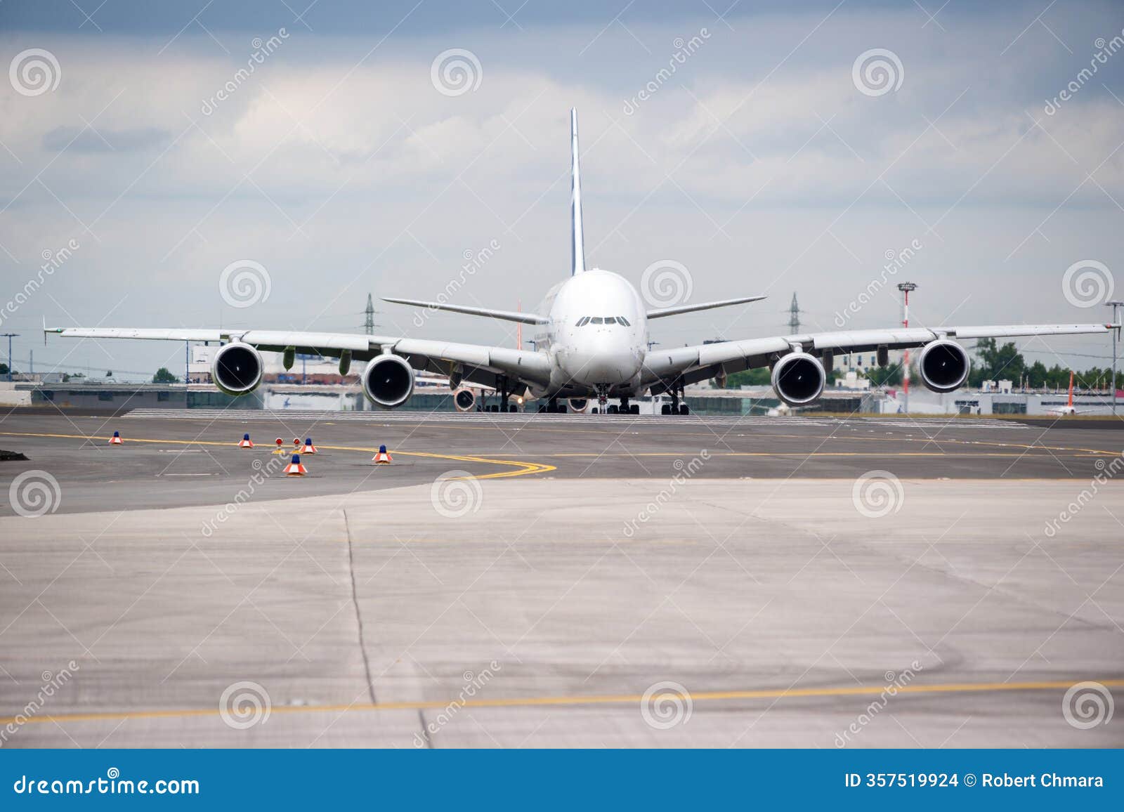 A Large Passenger Plane Stands At The Airfield, Front View Of The ...