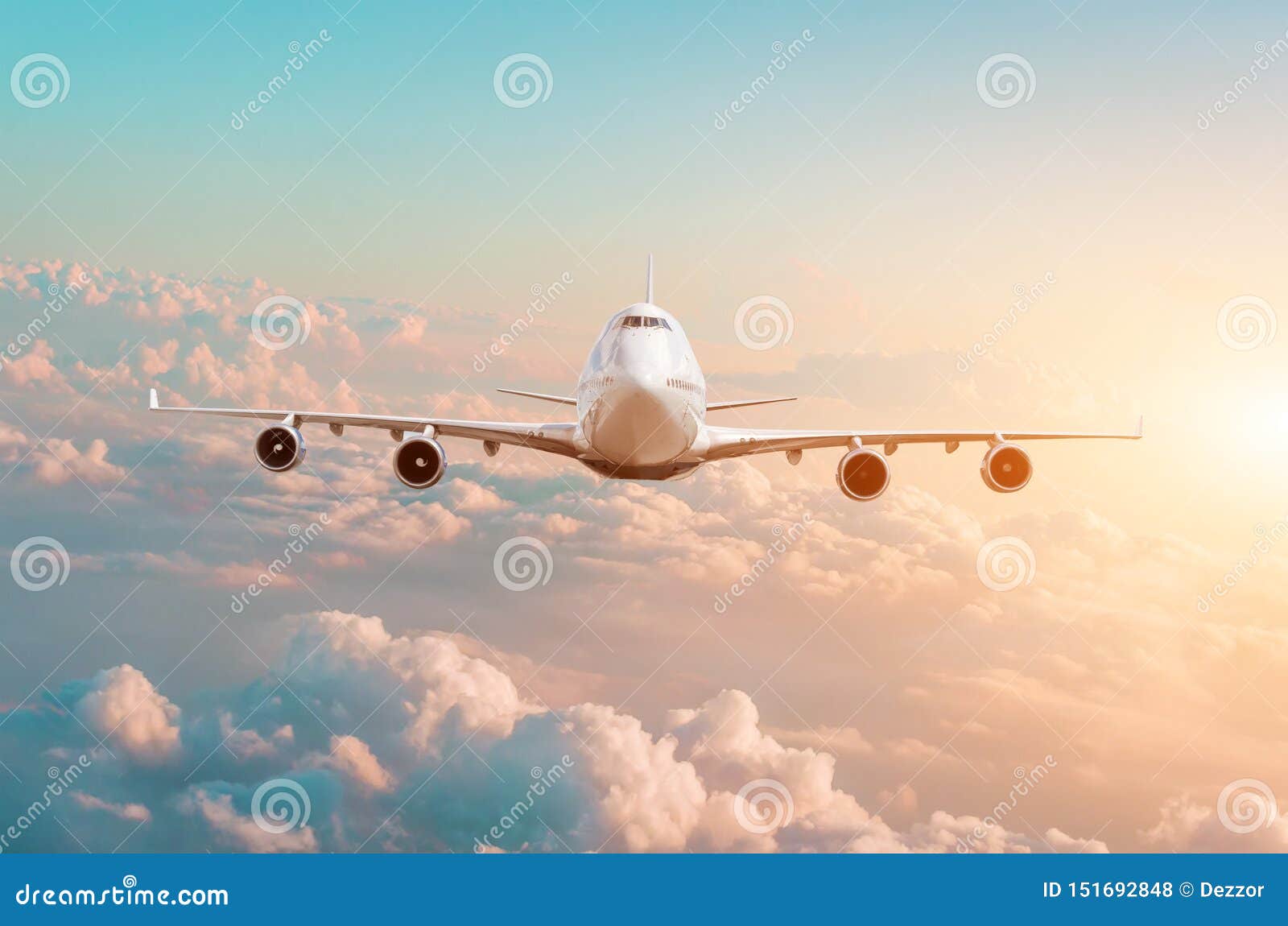 Large Passenger Plane with Four Engines Flies in the Sky at Sunset ...