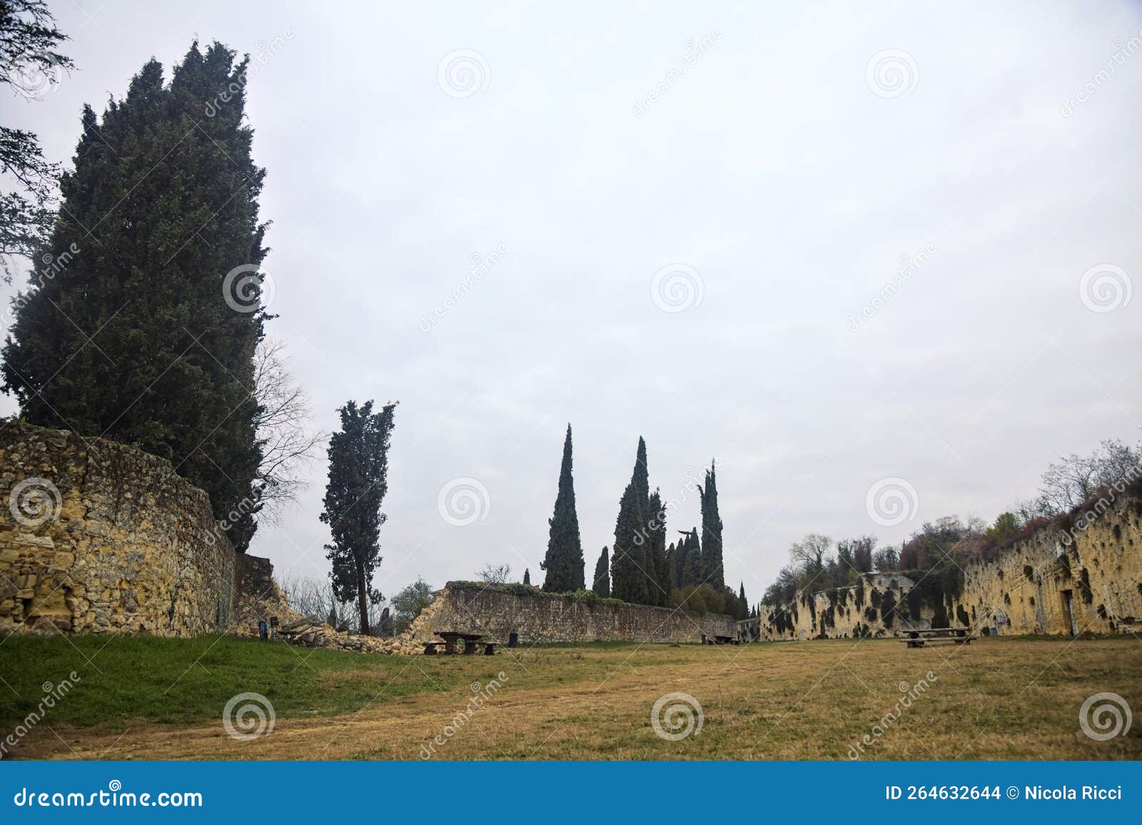 Large Pathway between Stone Walls in a Park on a Cloudy Day in Autumn ...