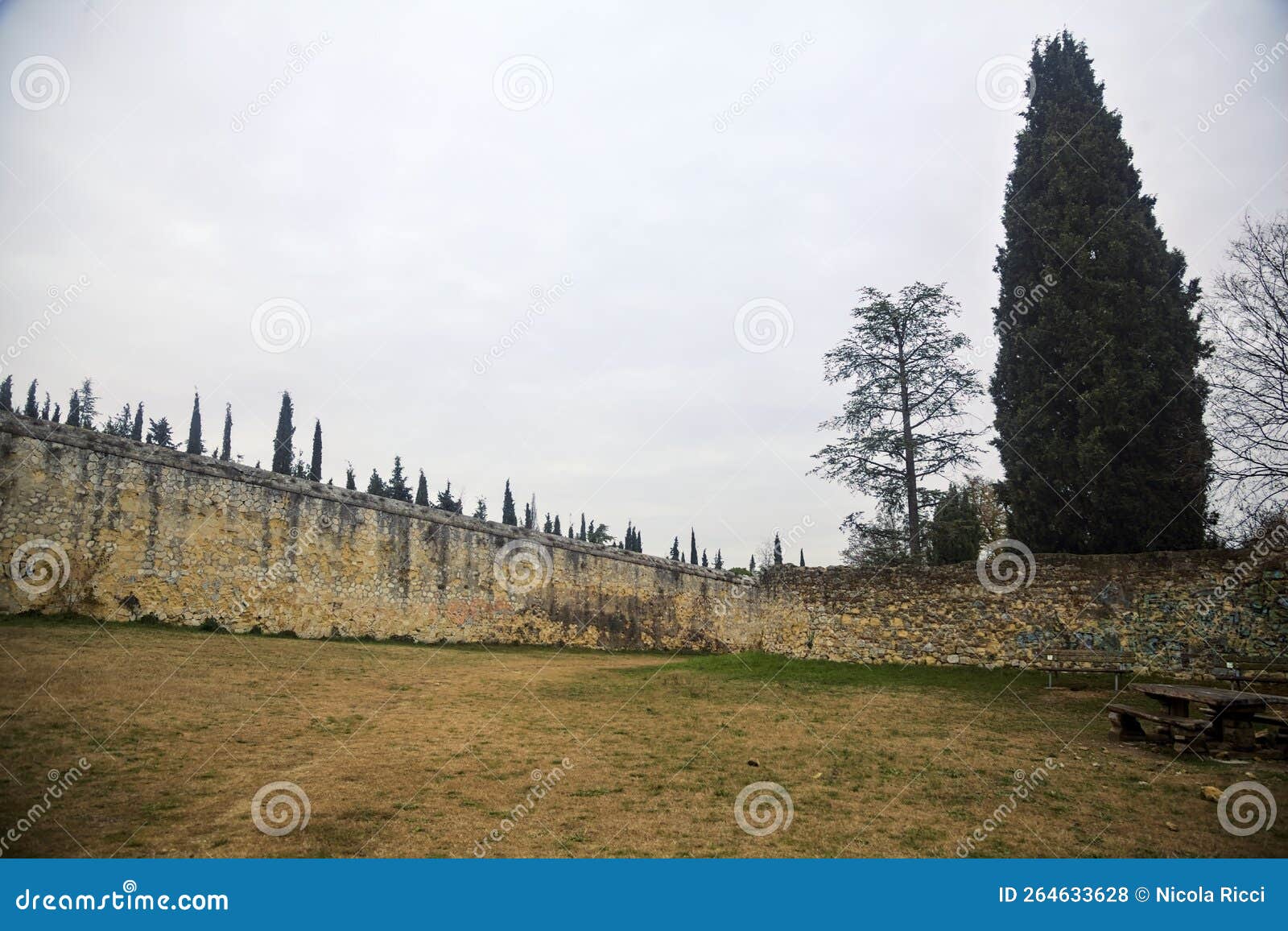 Large Pathway between Stone Walls in a Park on a Cloudy Day in Autumn ...
