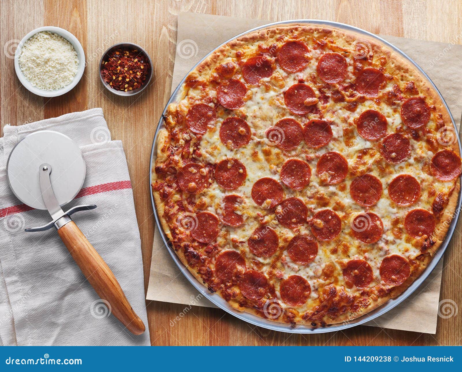 Large Pepperoni Pizza on Wooden Table Stock Photo - Image of snack ...