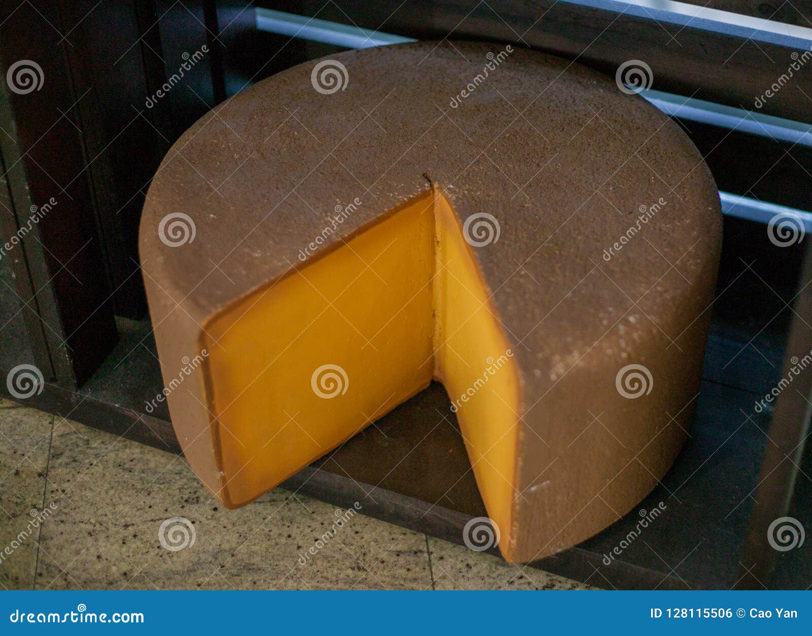 A Large Piece of Yellow Cheese Stock Photo - Image of wheel, cheese ...