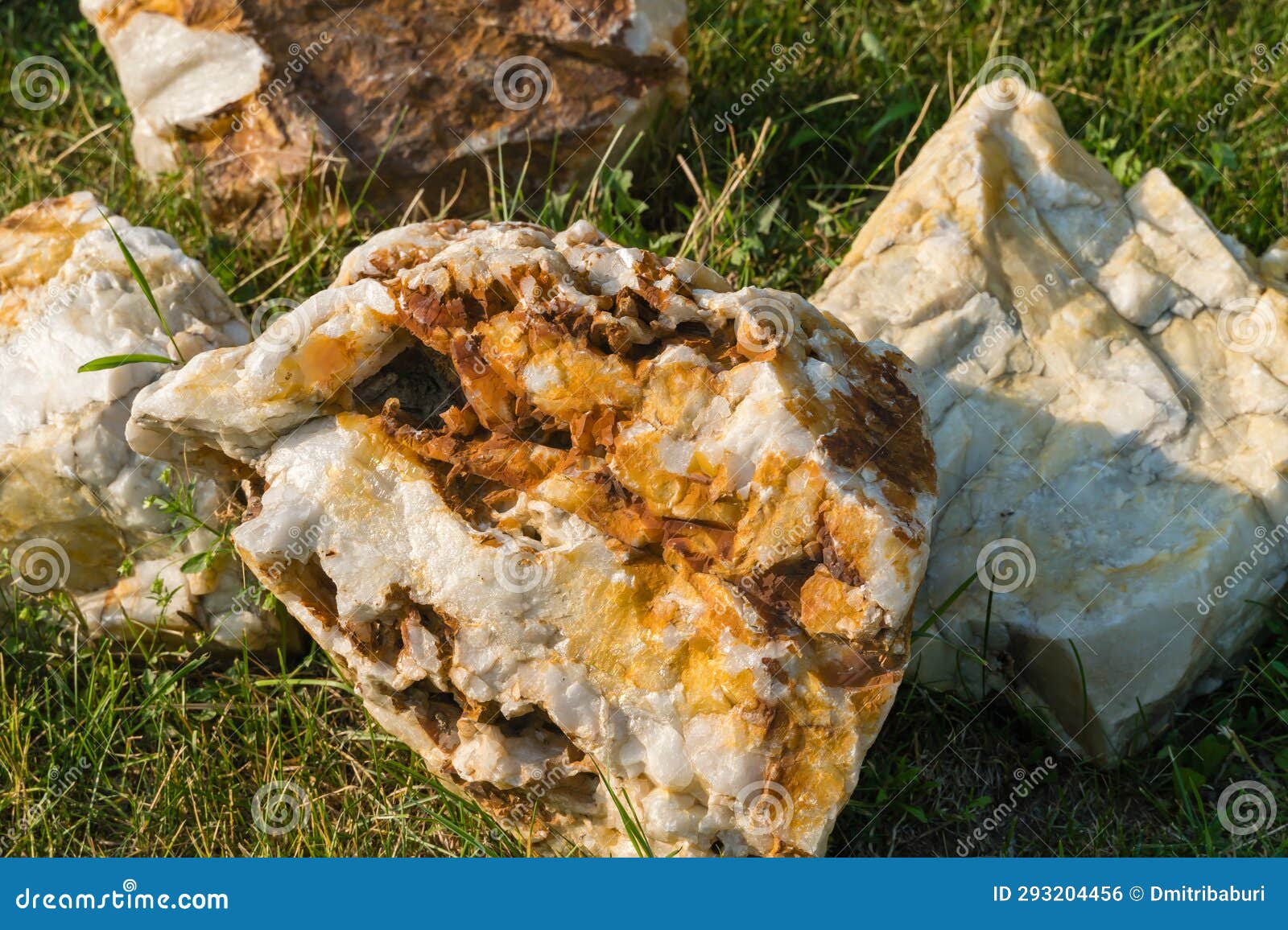 Large Pieces of Natural Quartz Mineral on the Lawn. Stock Photo - Image ...