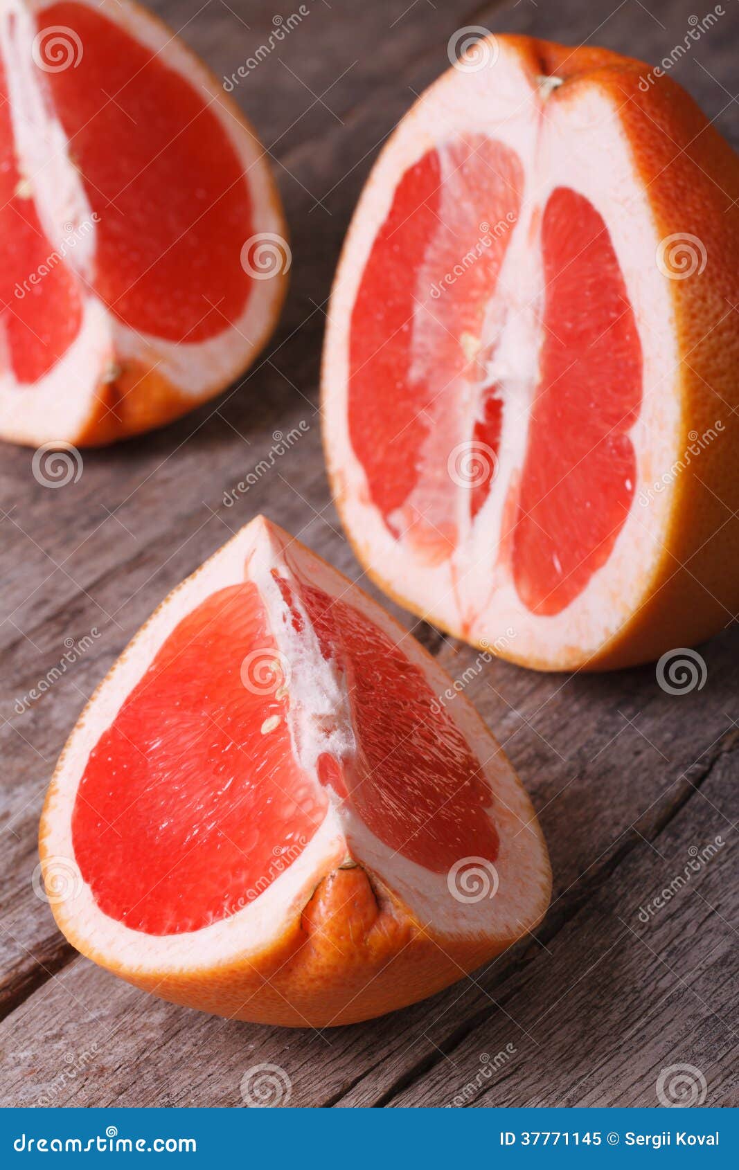 Large Pieces of Red Grapefruit on the Old Wooden Stock Image - Image of ...