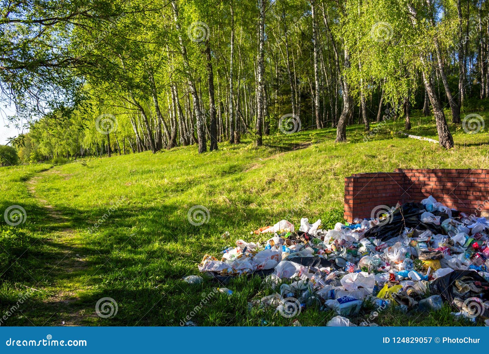 A Large Pile Of Garbage In The Background Of A Beautiful Landscape ...