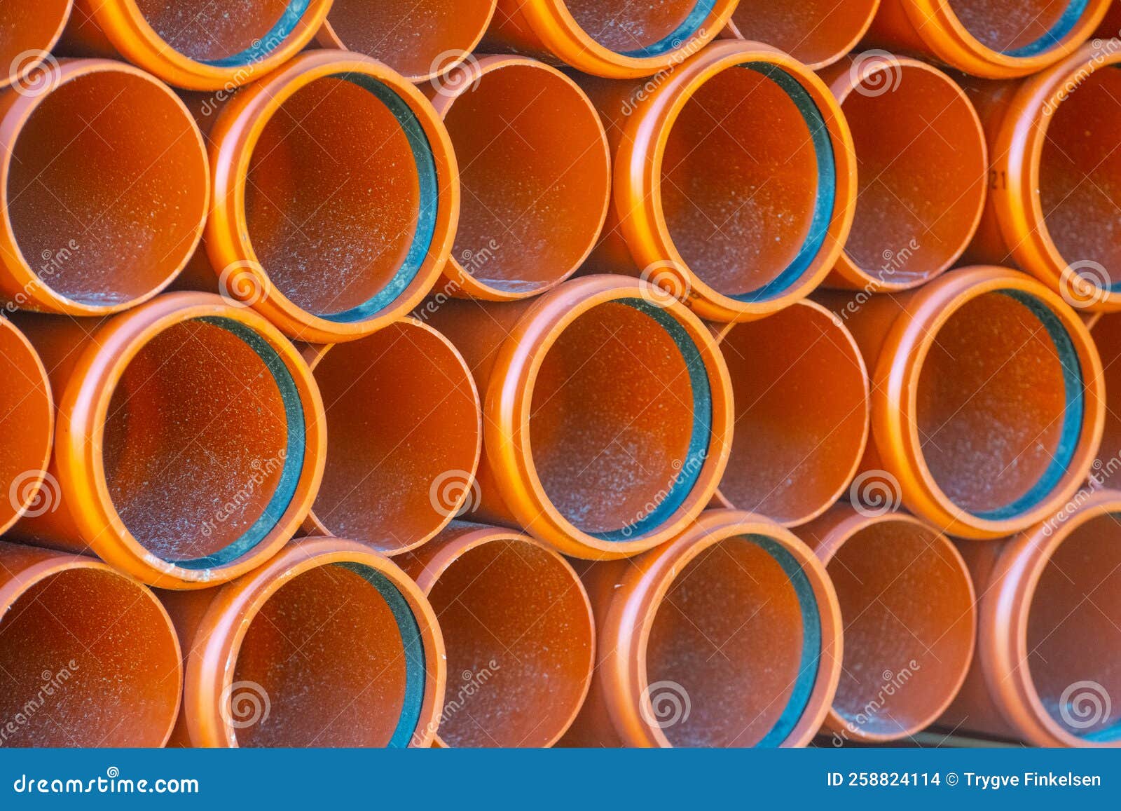 Large Pile of Orange Plastic PVC Pipes.. Stock Photo - Image of ...