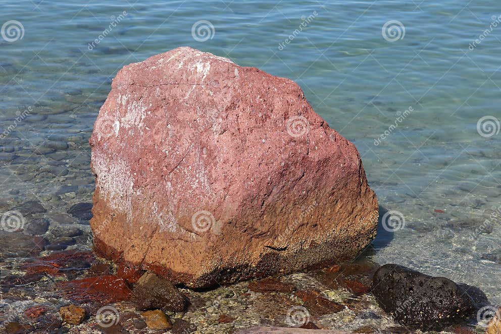 A Large Pink Rock by the Beach. Stock Image - Image of nature, water ...