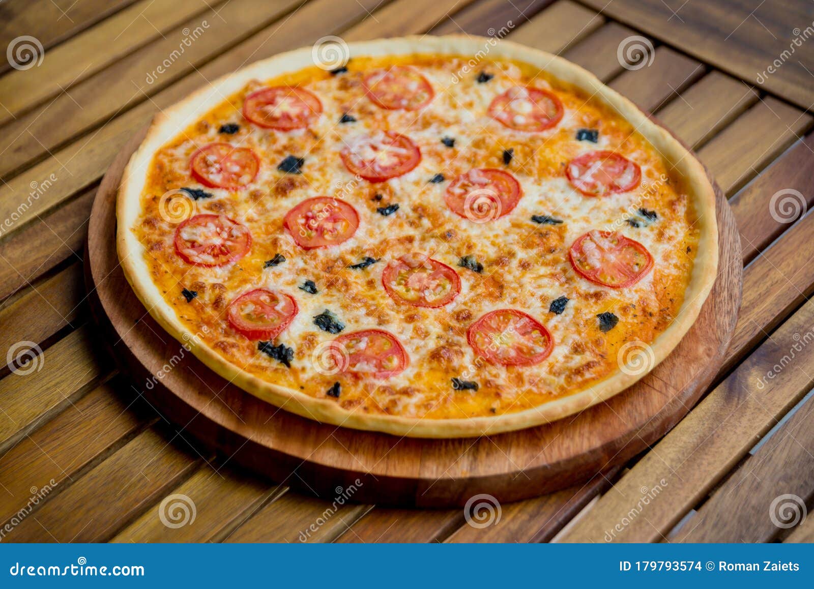 Large Pizza on a Wooden Table. Restaurant. Stock Photo - Image of ...