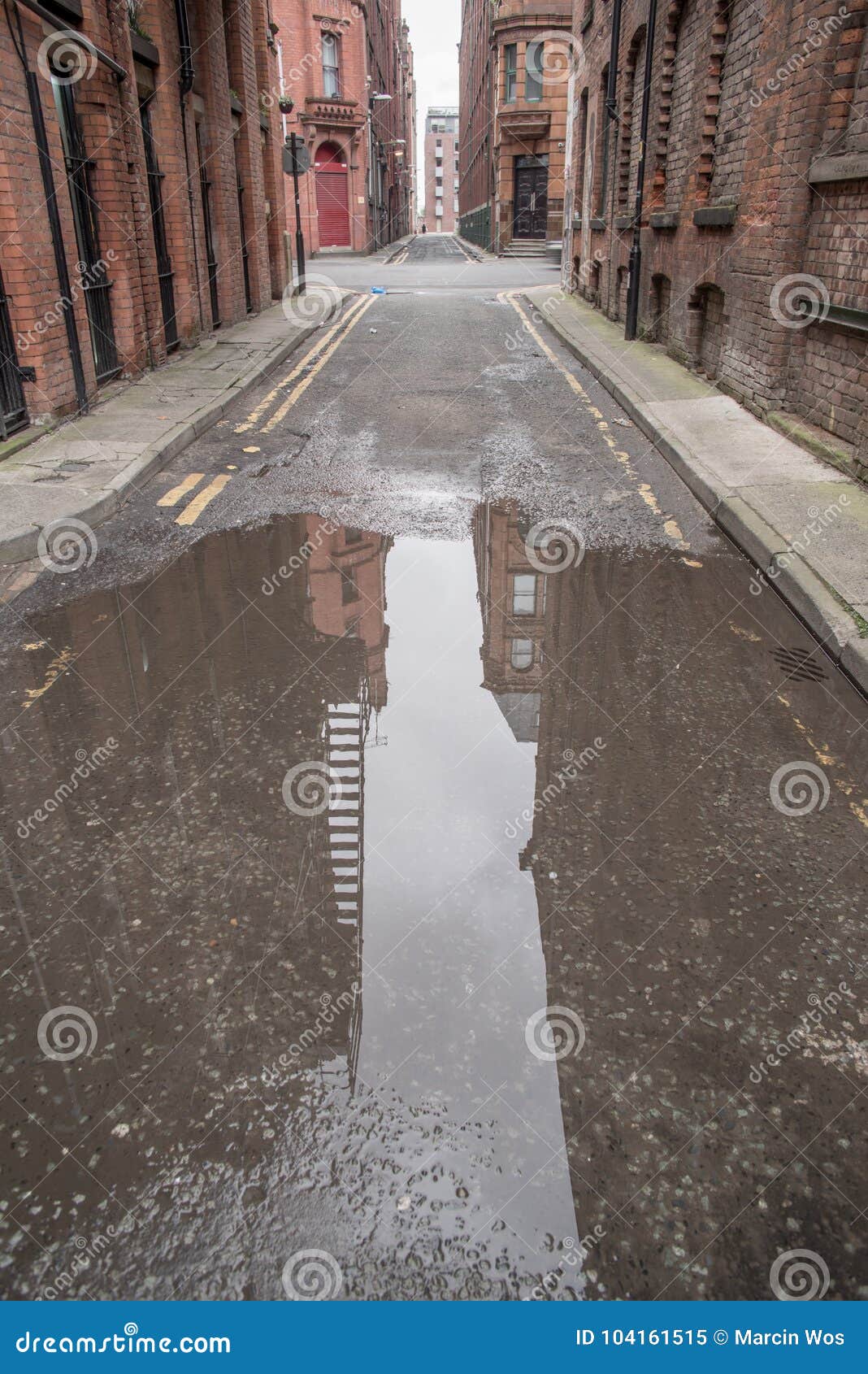 A Large Puddle on the Road with the Reflection Manchester Stock Image ...