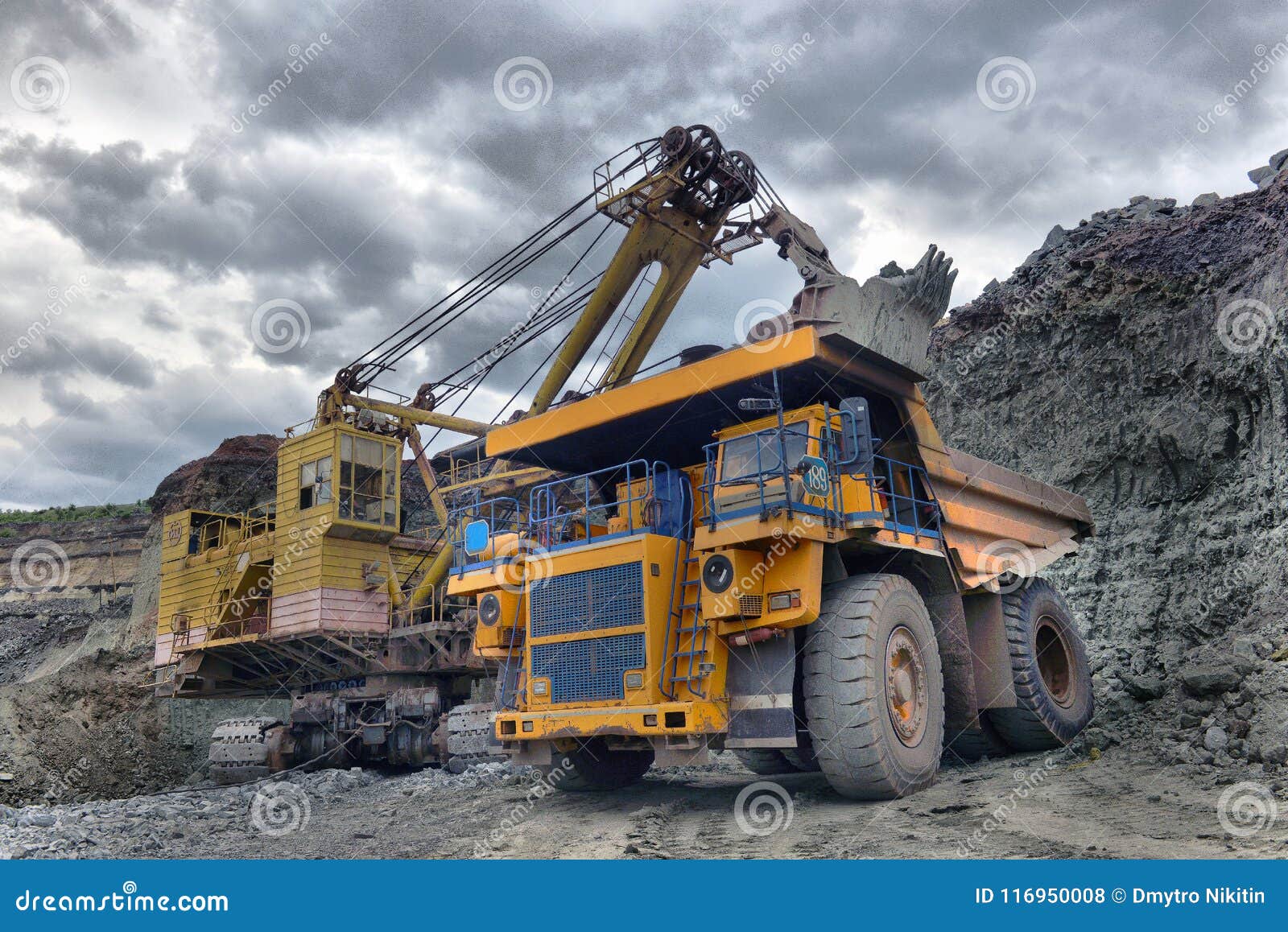 Large Quarry Dump Truck. Loading the Rock in the Dumper Stock Photo ...