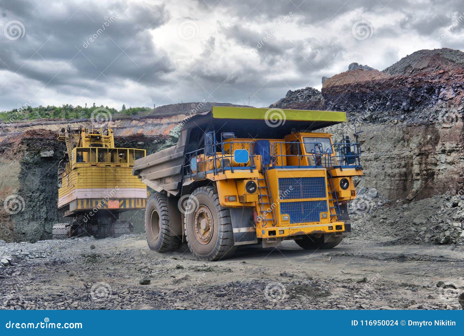 Large Quarry Dump Truck. Loading the Rock in the Dumper Stock Photo ...