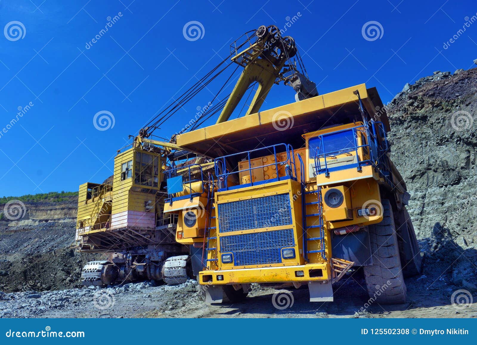 Large Quarry Dump Truck. Loading the Rock in the Dumper Stock Photo ...