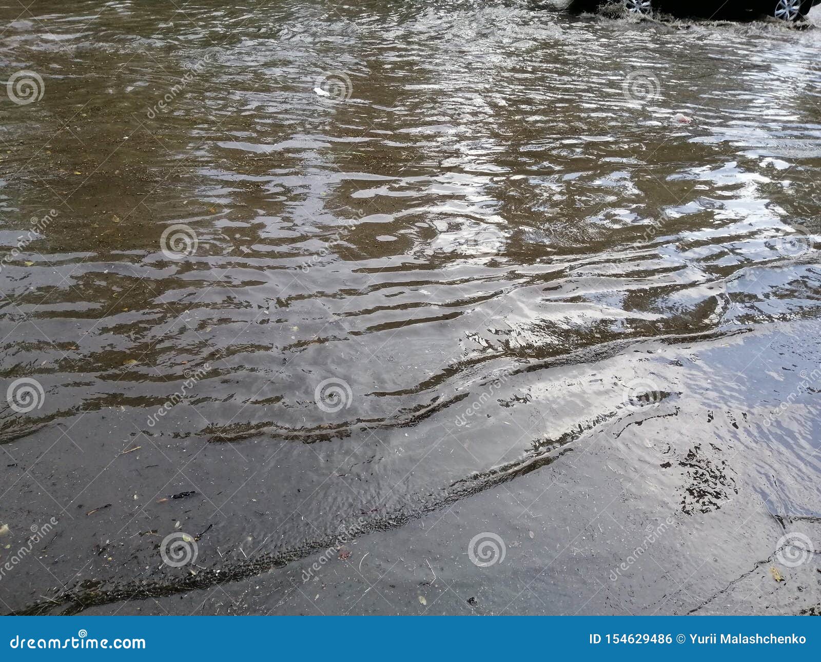 Large Rain Puddle on City Street Stock Photo - Image of rain, puddle ...