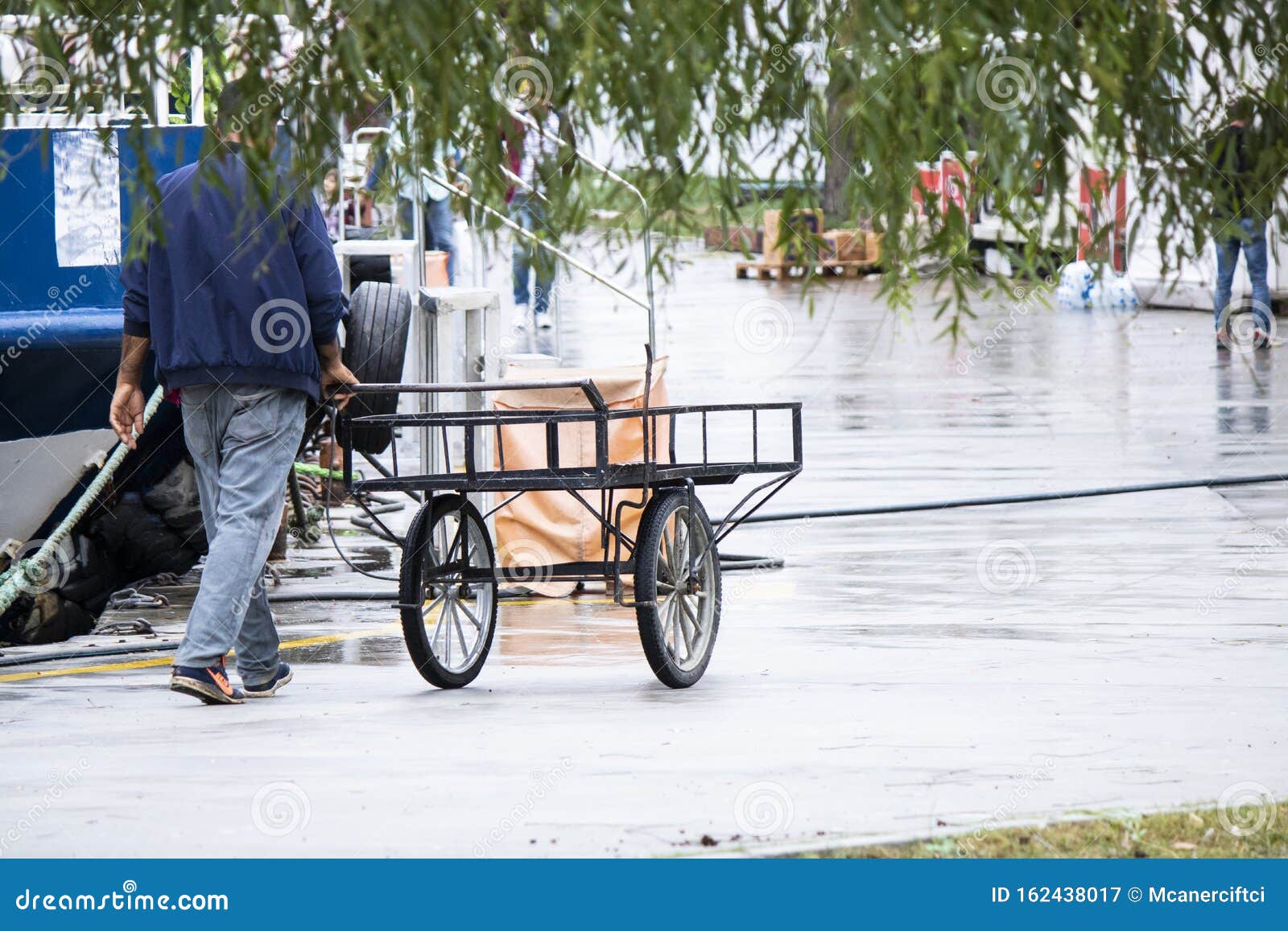 Large Rectangular Wheelbarrow. it Has Tree Wheels. it is Used To ...