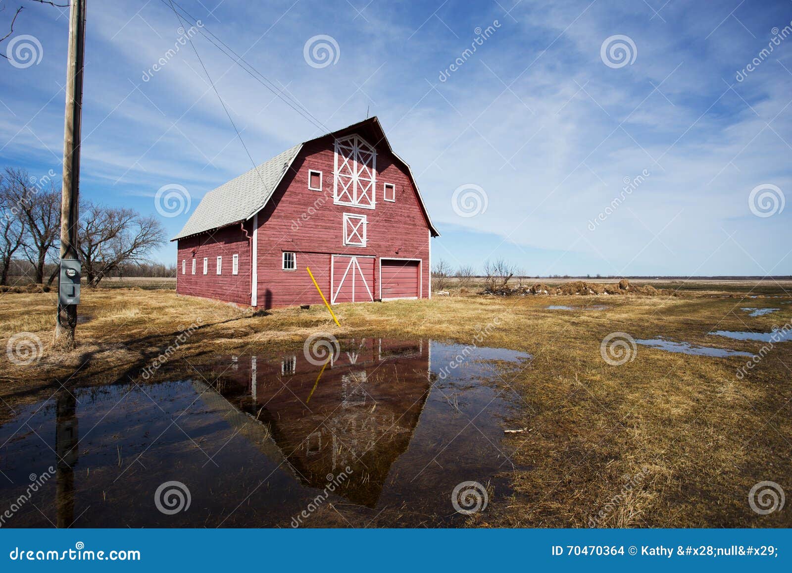 Large Red Barn Reflected in Puddle of Water Stock Photo - Image of ...