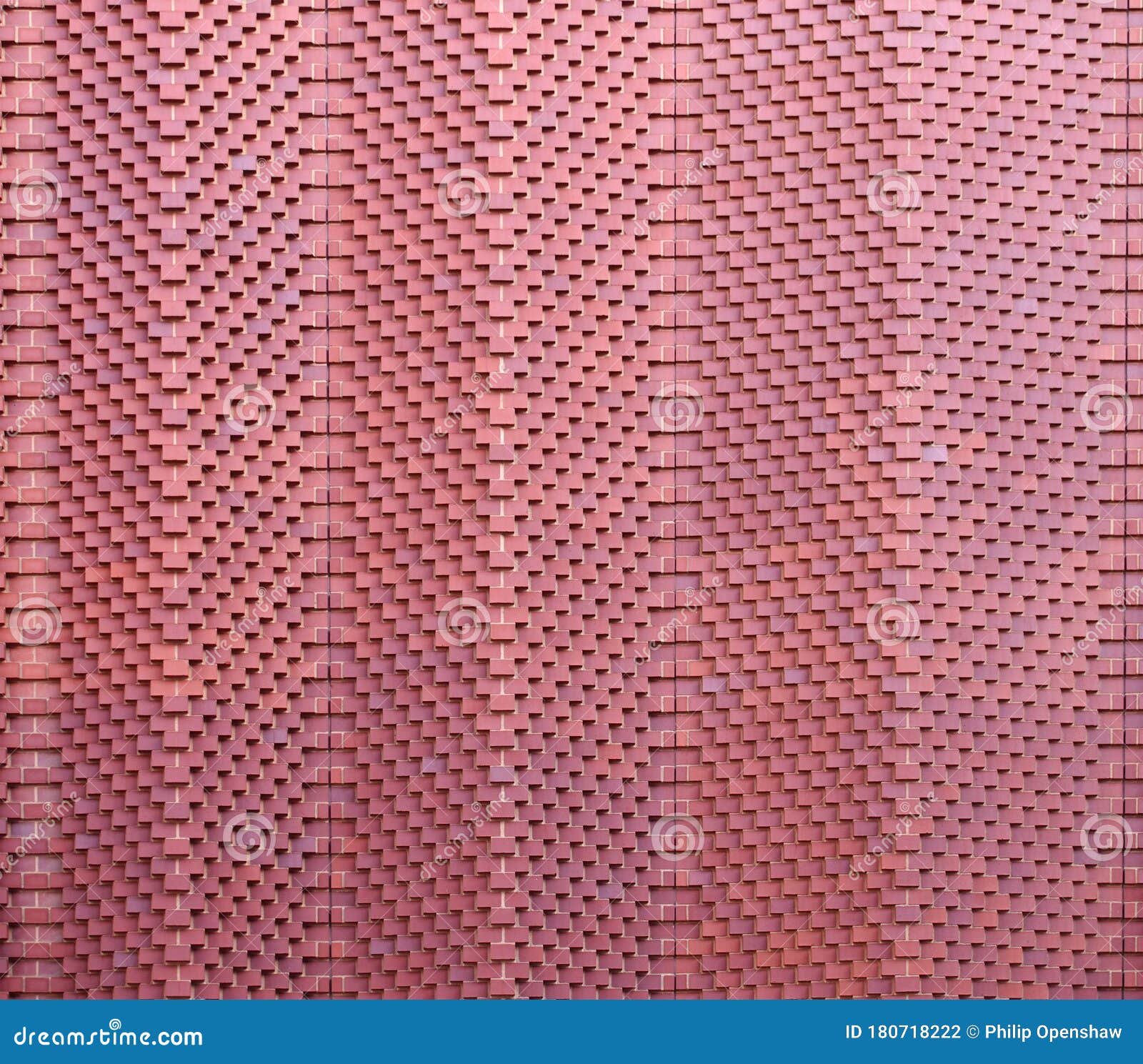 Large Red Brick Wall with Geometric Angular Repeating Patterns and Rows ...