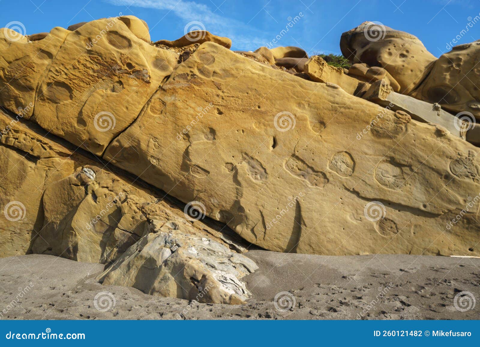 Large Rock Formation Coming Out of Sand Stock Photo - Image of ...