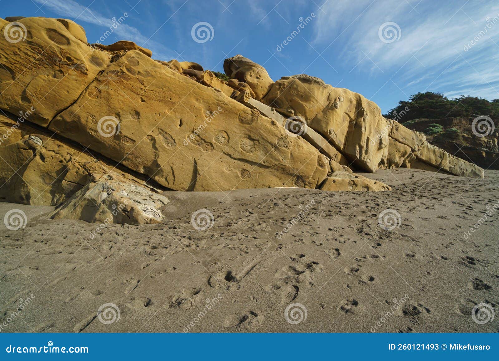 Large Rock Formation Coming Out of Sand Stock Image - Image of large ...