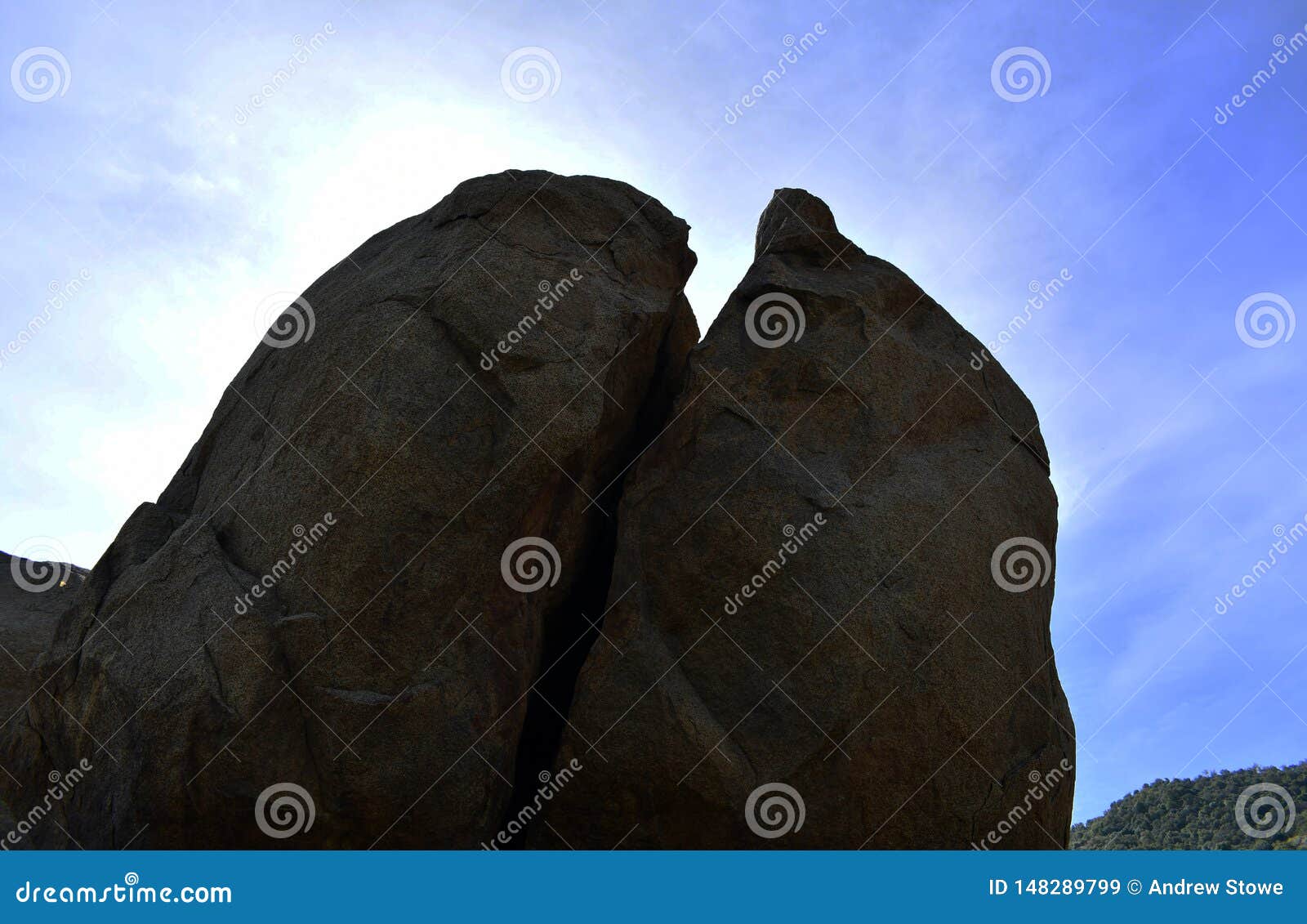 Large Rock Split in Two with Sun Stock Image - Image of rock, granite ...
