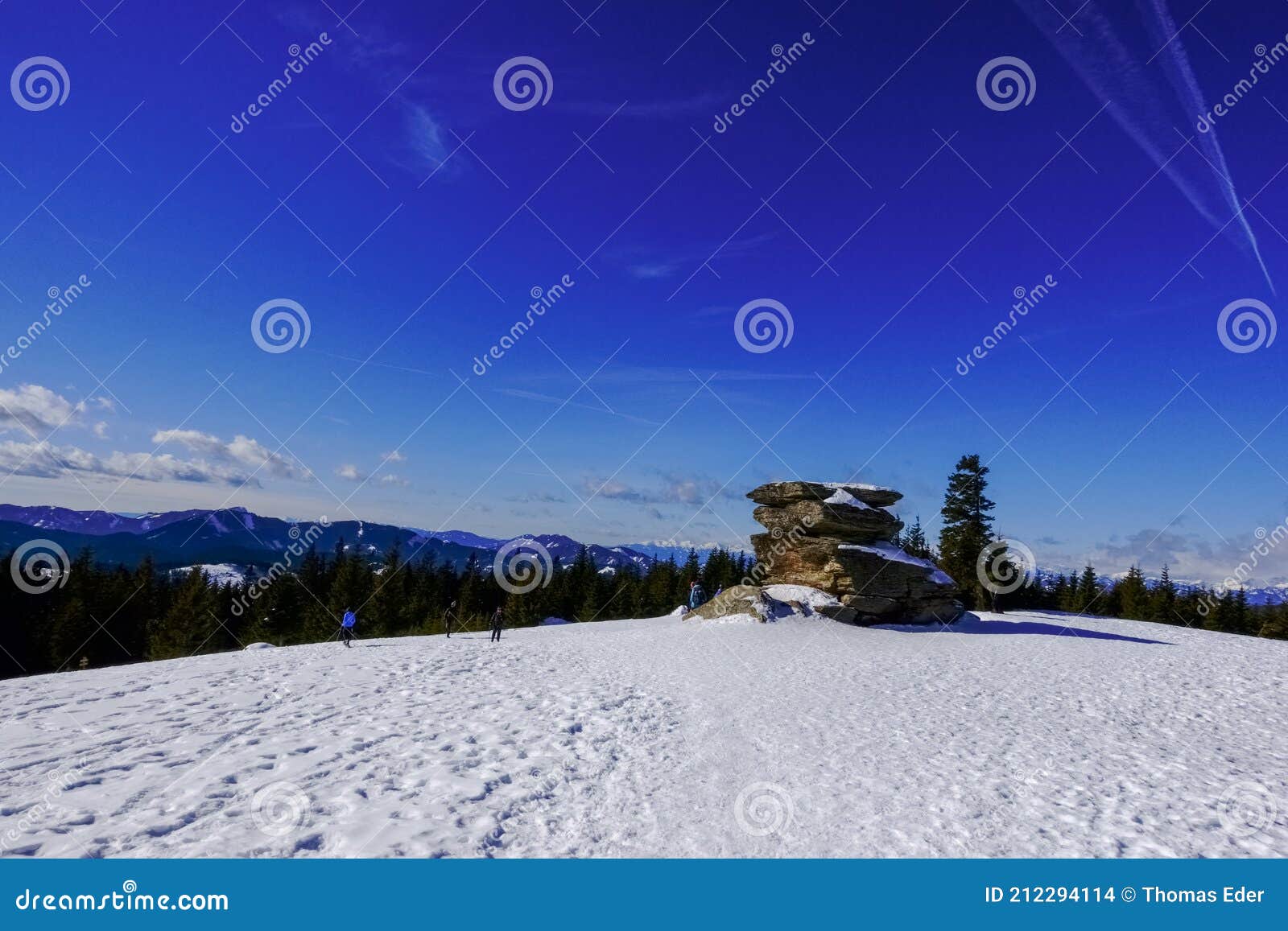 Large Rock on the Top of a Mountain with Snow and Blue Sky Stock Photo ...
