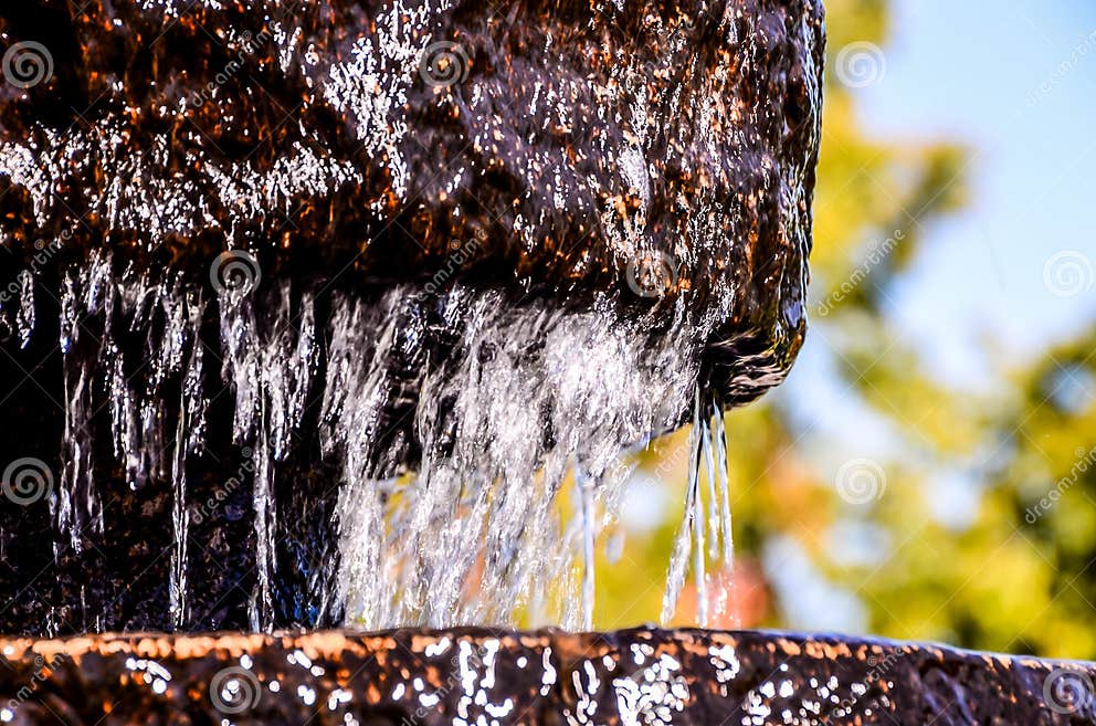A Large Rock with Water Dripping from it Stock Image - Image of ...