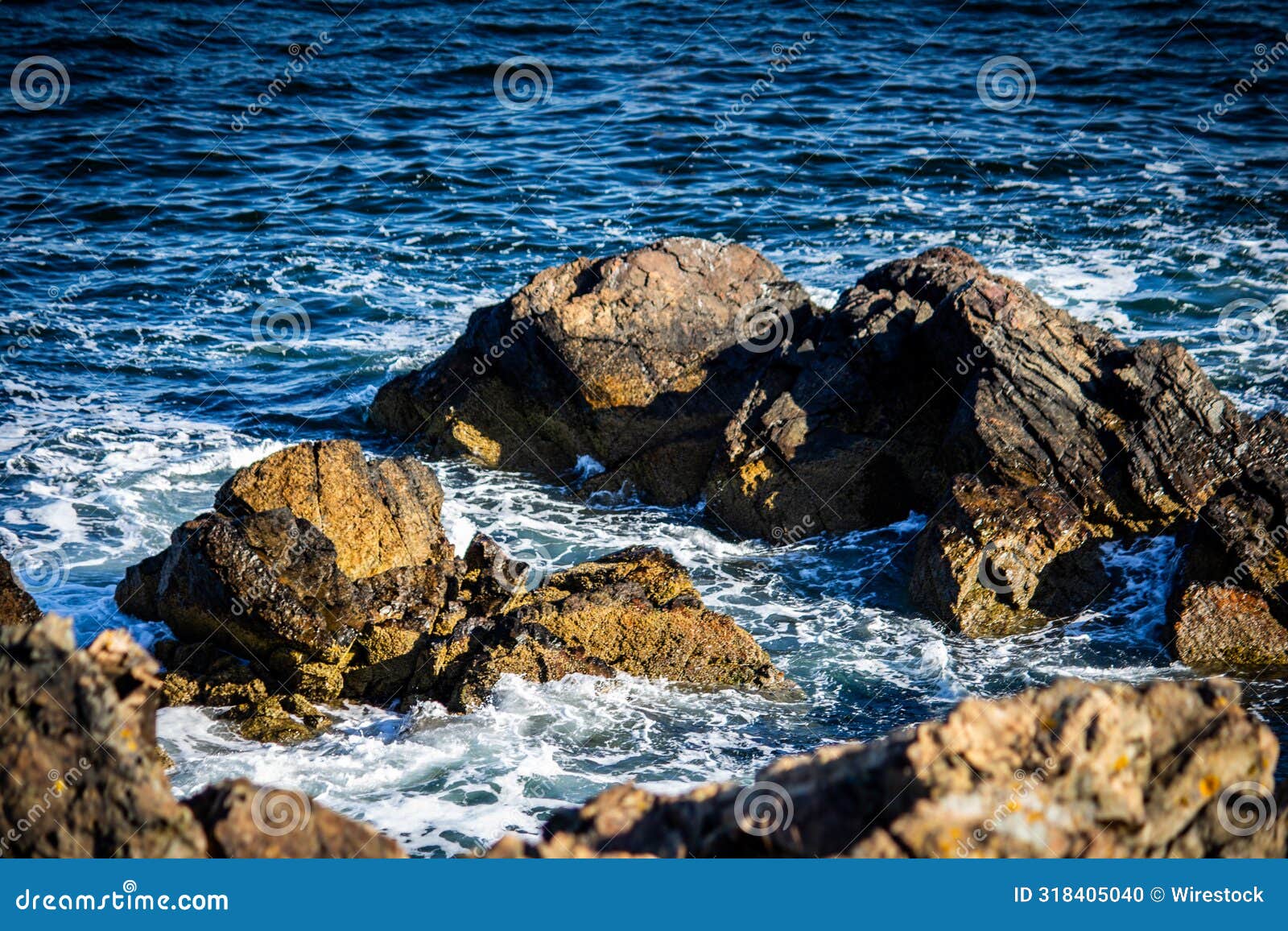Rocks by ocean water stock photo. Image of ocean, waves - 318405040
