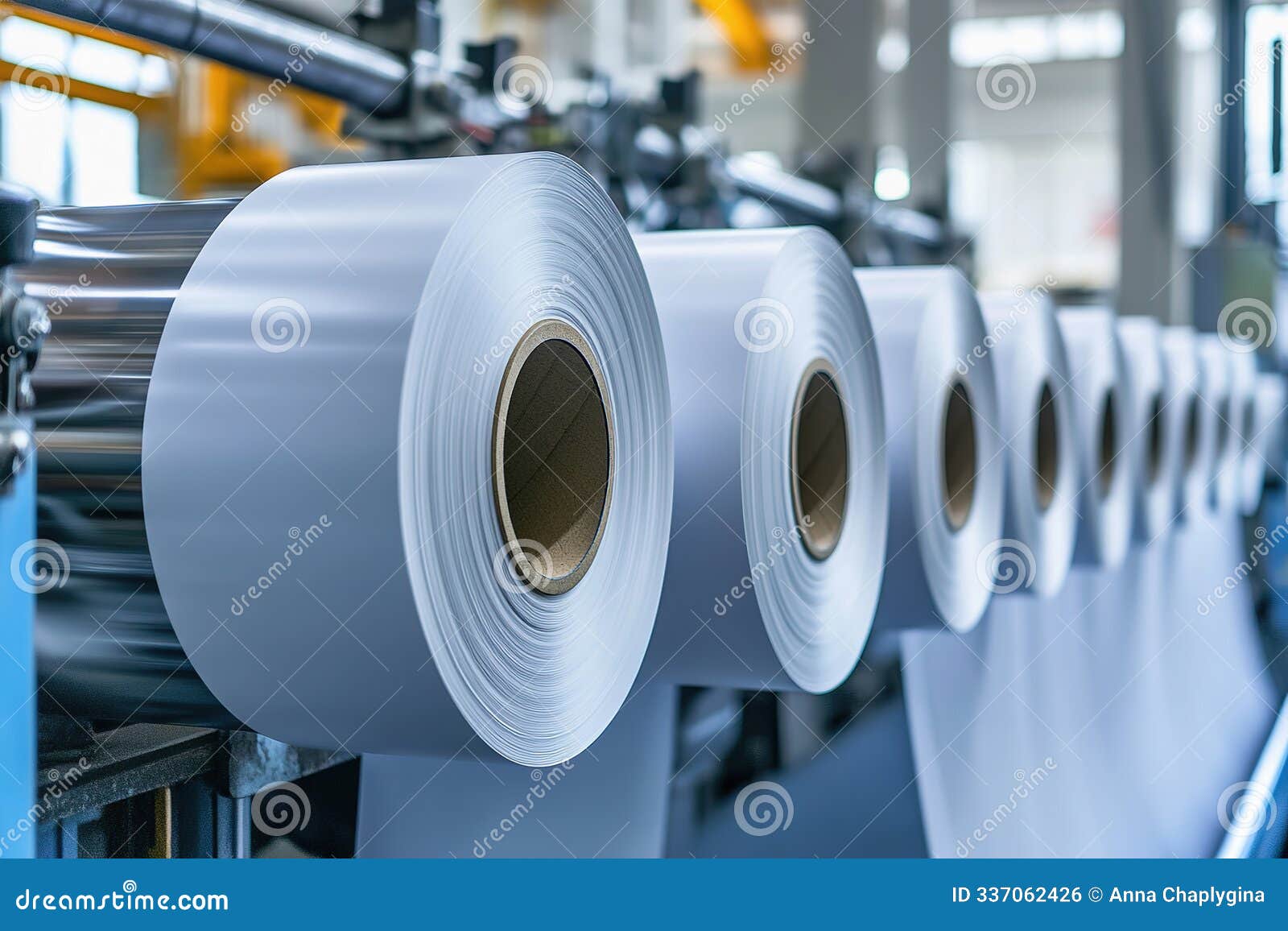 Large Rolls of Paper Lined Up in Printing Press during Production ...