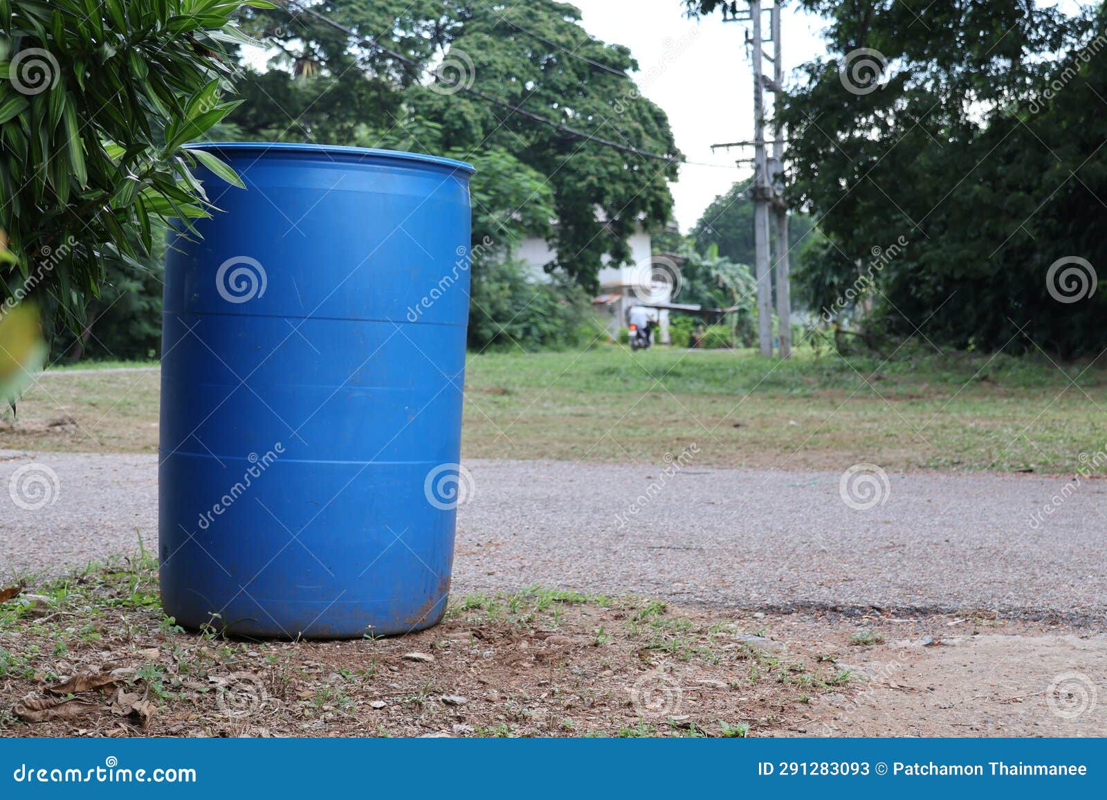 Large Round Blue Plastic Trash Can Placed in Village Street, Garbage ...