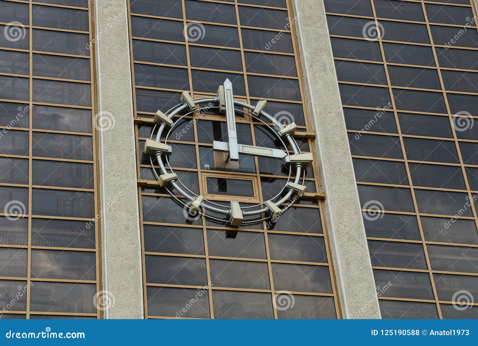 Large Round Clock on the Outer Glass Wall of the Building Stock Photo ...