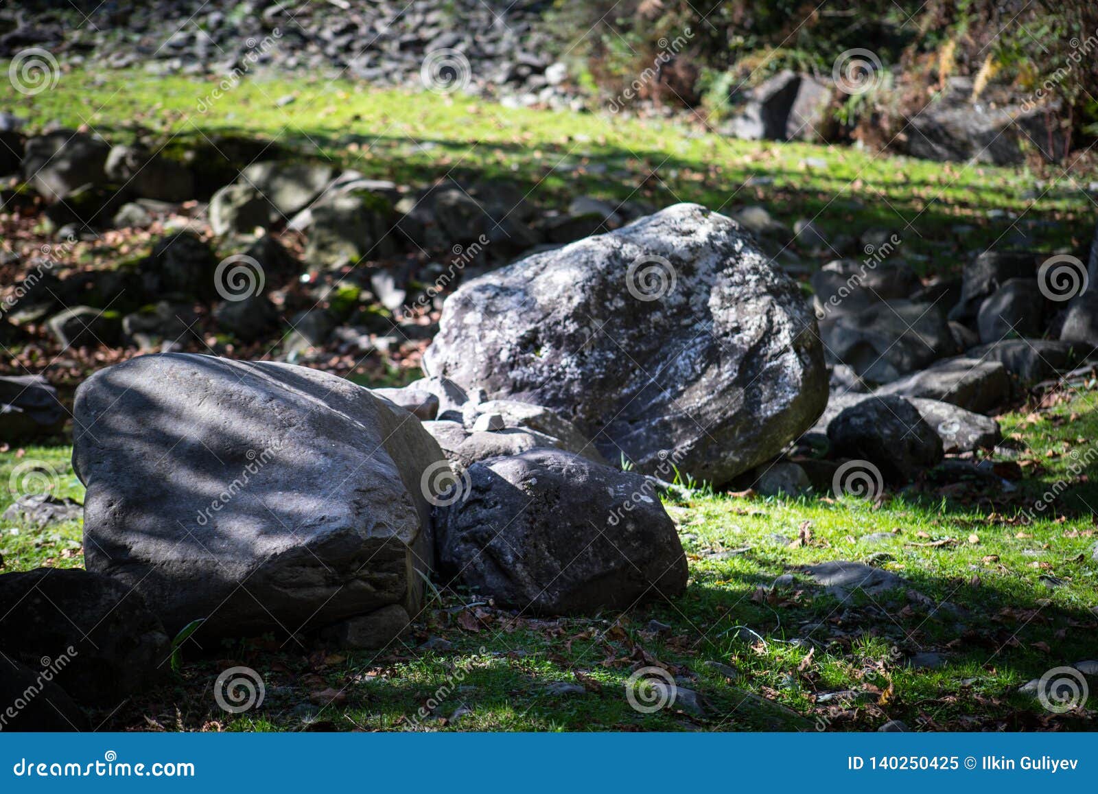 Large Round Stone on the Green Grass Stock Image - Image of nature ...