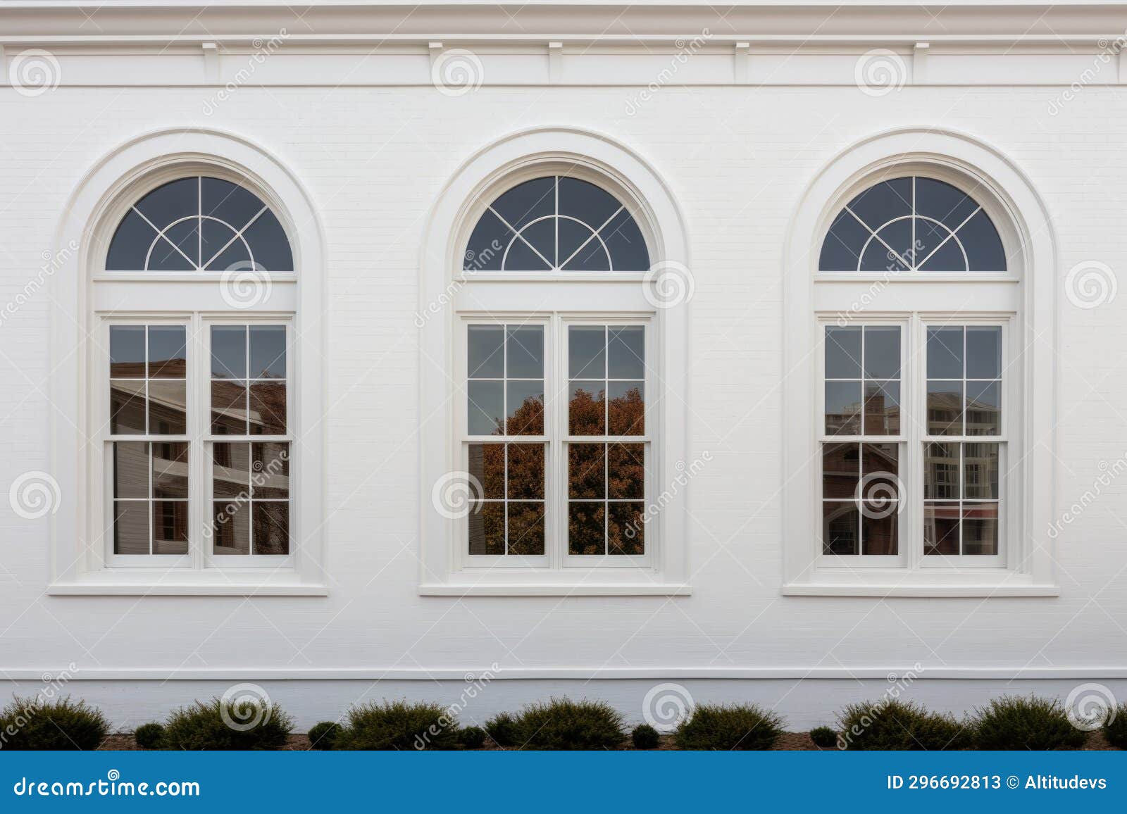 Large Rounded Windows on a White Italianate Building Stock Image ...