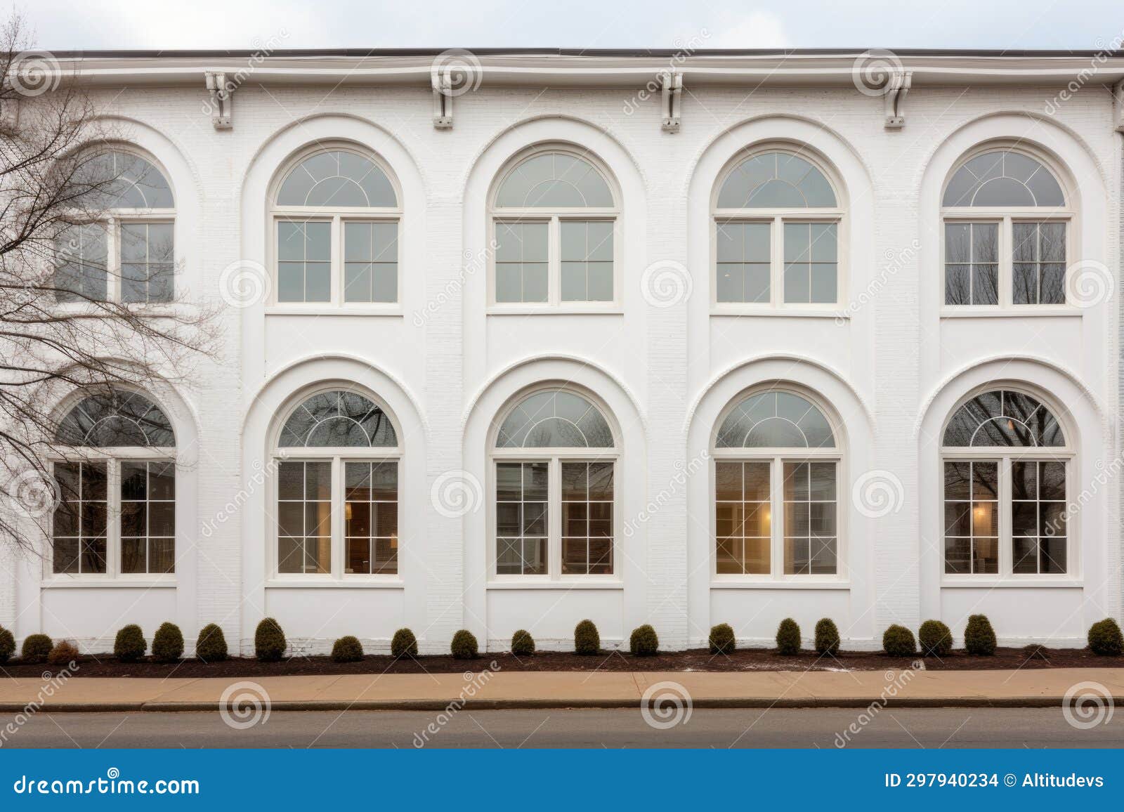 Large Rounded Windows on a White Italianate Building Stock Photo ...