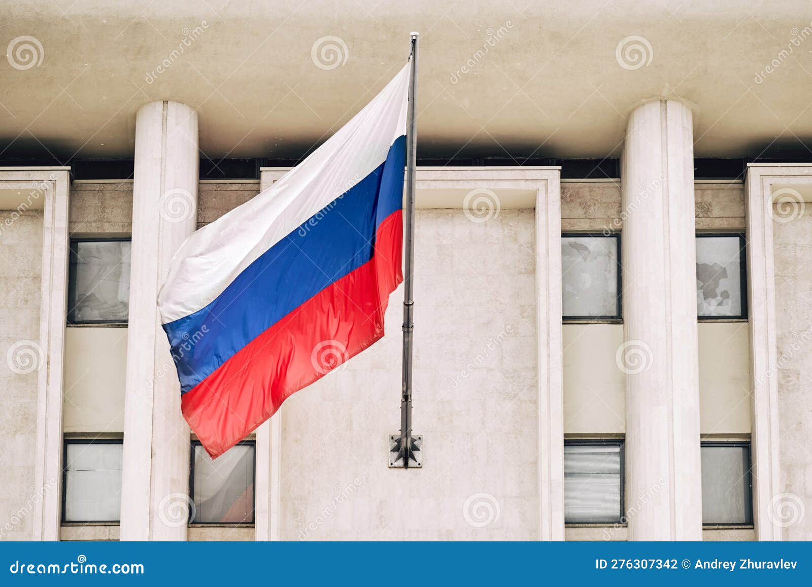 A Large Russian Flag is Flying on a Building with Windows Stock Photo ...