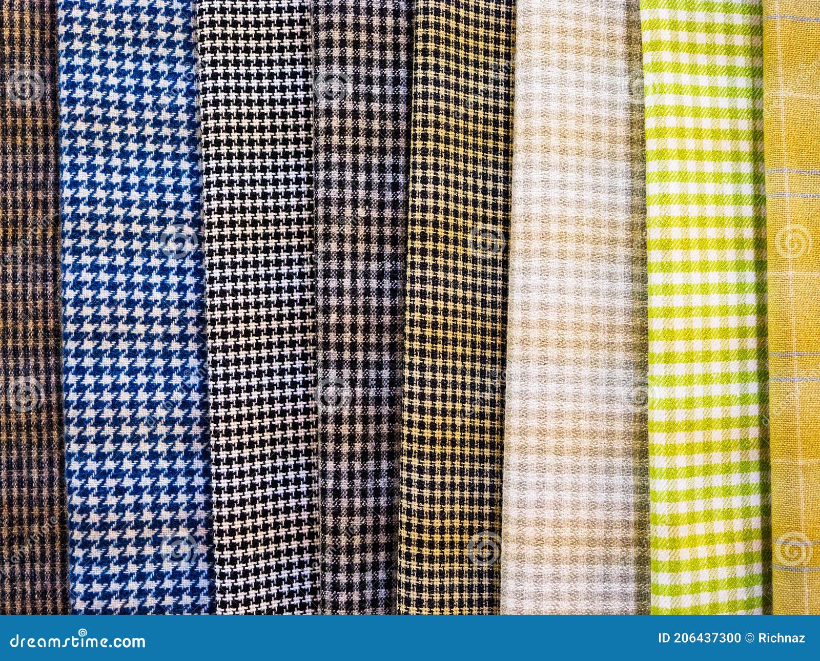 A Large Selection of Bright Plaid Fabrics in the Fabric Store. Close-up ...