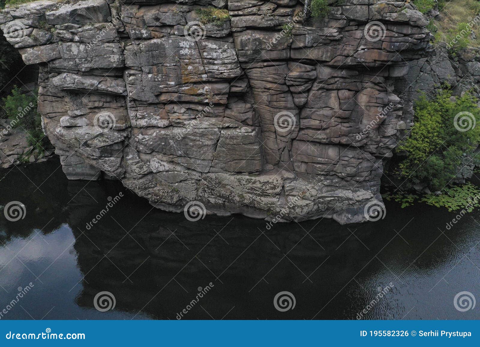 A Large Sheer Cliff Above the Water Stock Photo - Image of outside ...