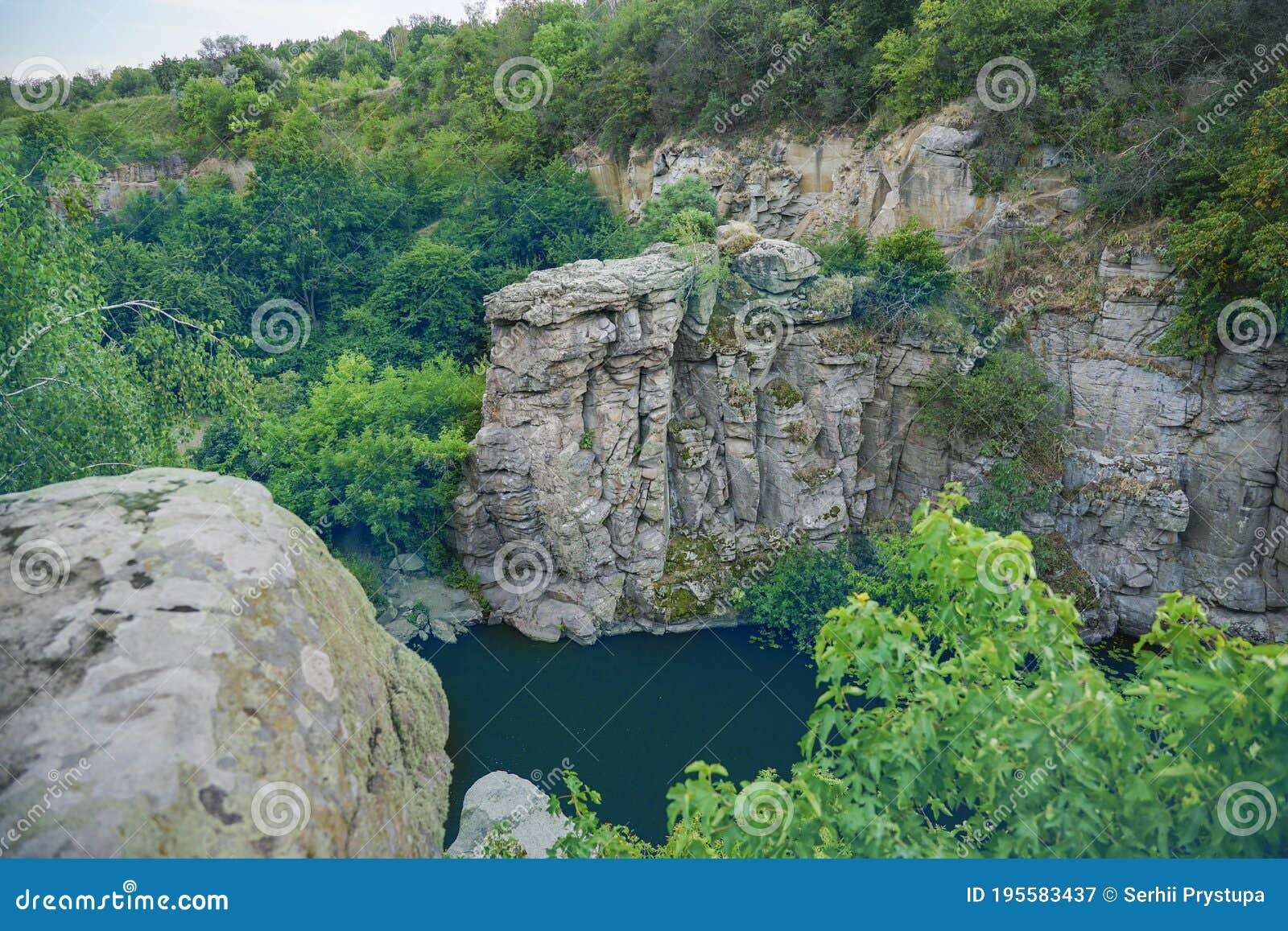 A Large Sheer Cliff Above the Water Stock Image - Image of abstract ...