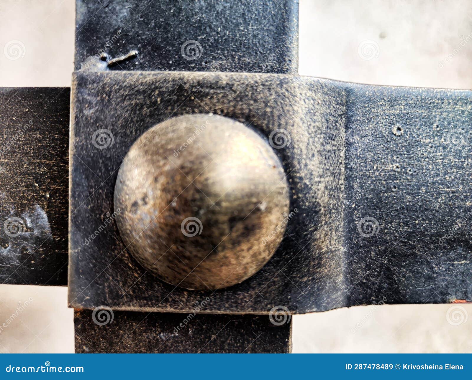 A Large Shiny Copper Round Metal Rivet at the Intersection and Cross of ...