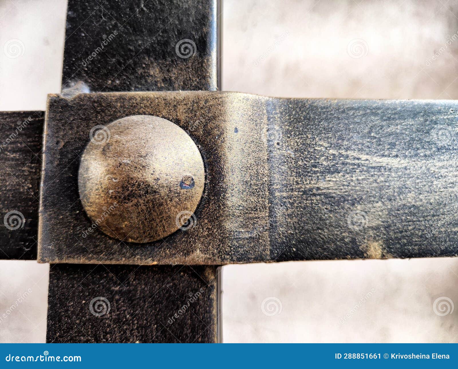 A Large Shiny Copper Round Metal Rivet at the Intersection and Cross of ...