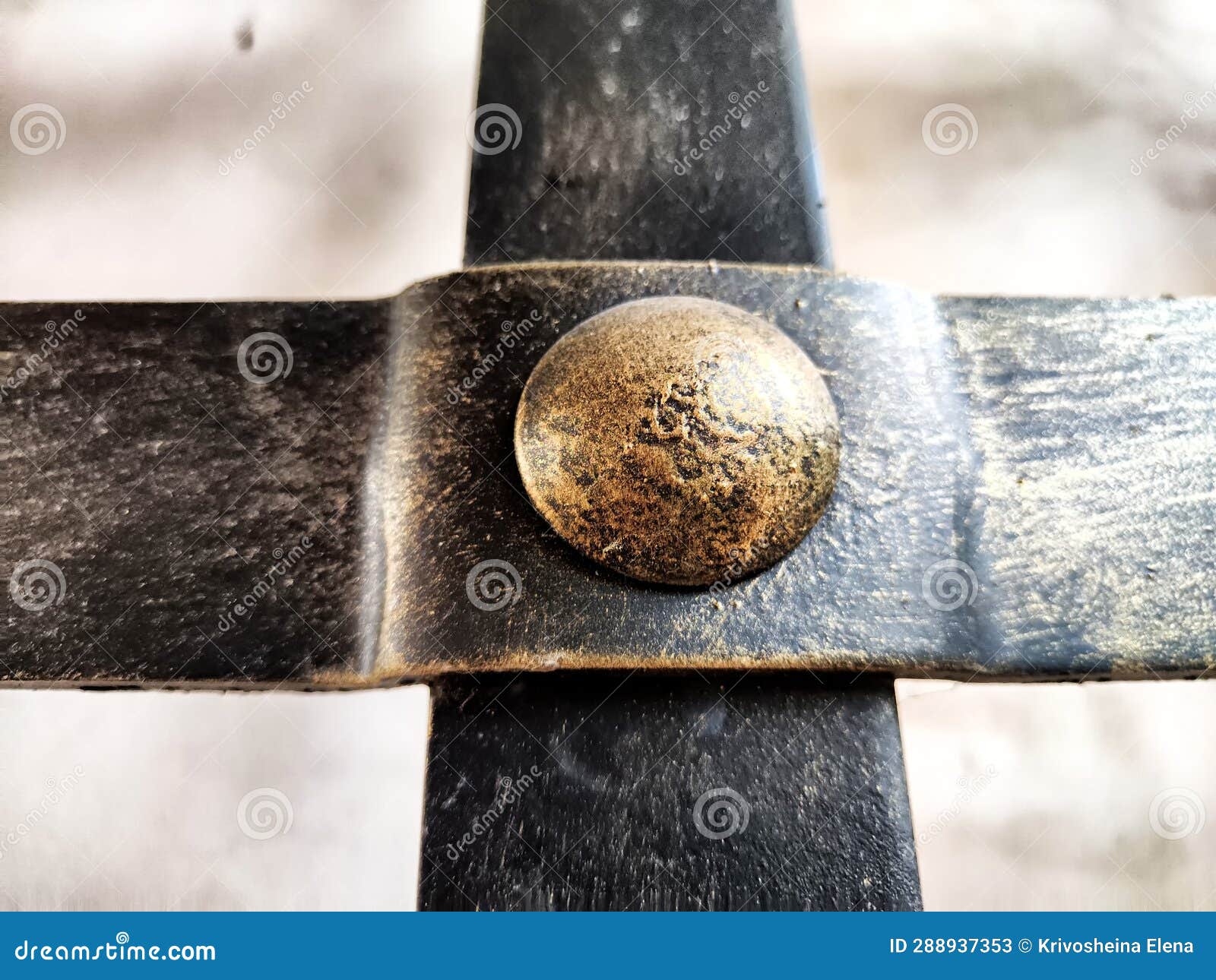 A Large Shiny Copper Round Metal Rivet at the Intersection and Cross of ...