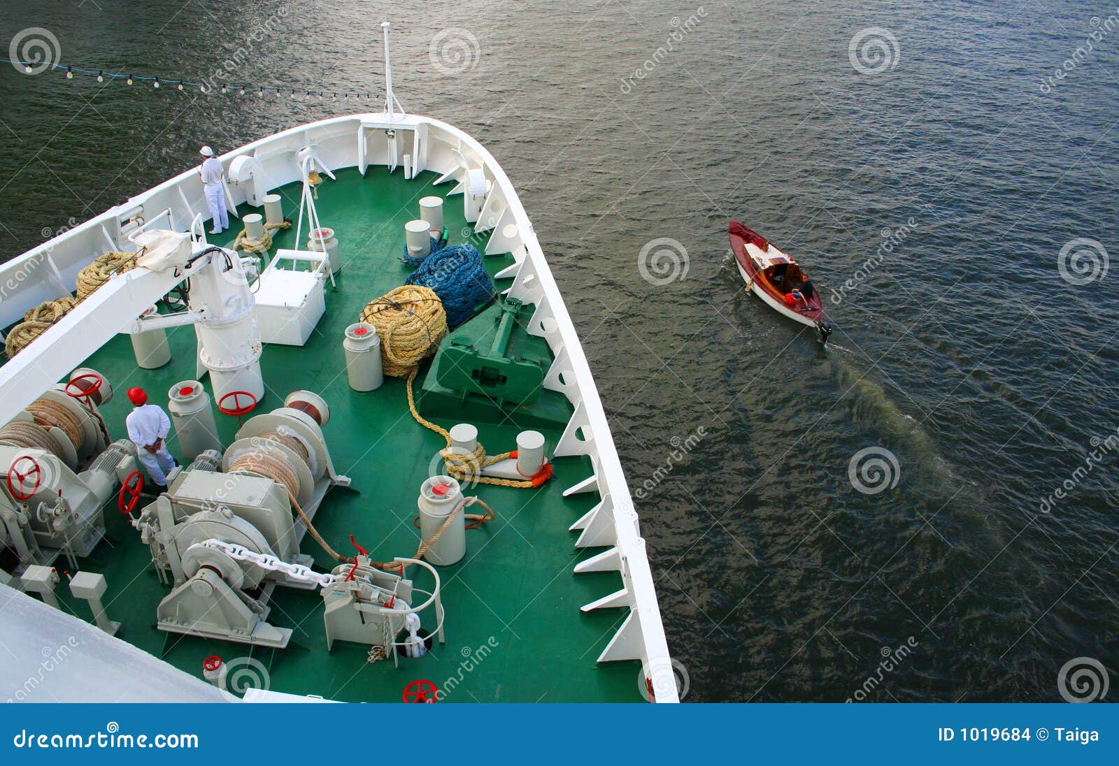 The Large Ship and Small Boat beside in the High Sea. Stock Photo ...