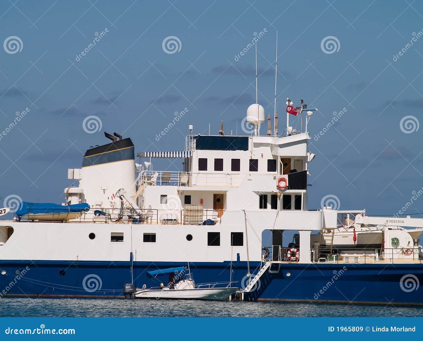 Large ship and tender boat stock image. Image of small - 1965809