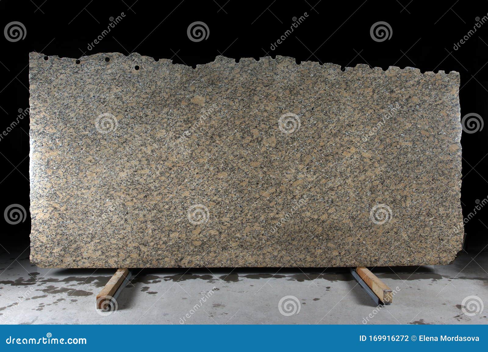 A Large Slab of Natural Yellow Stone with Dark Dots Called Granite ...