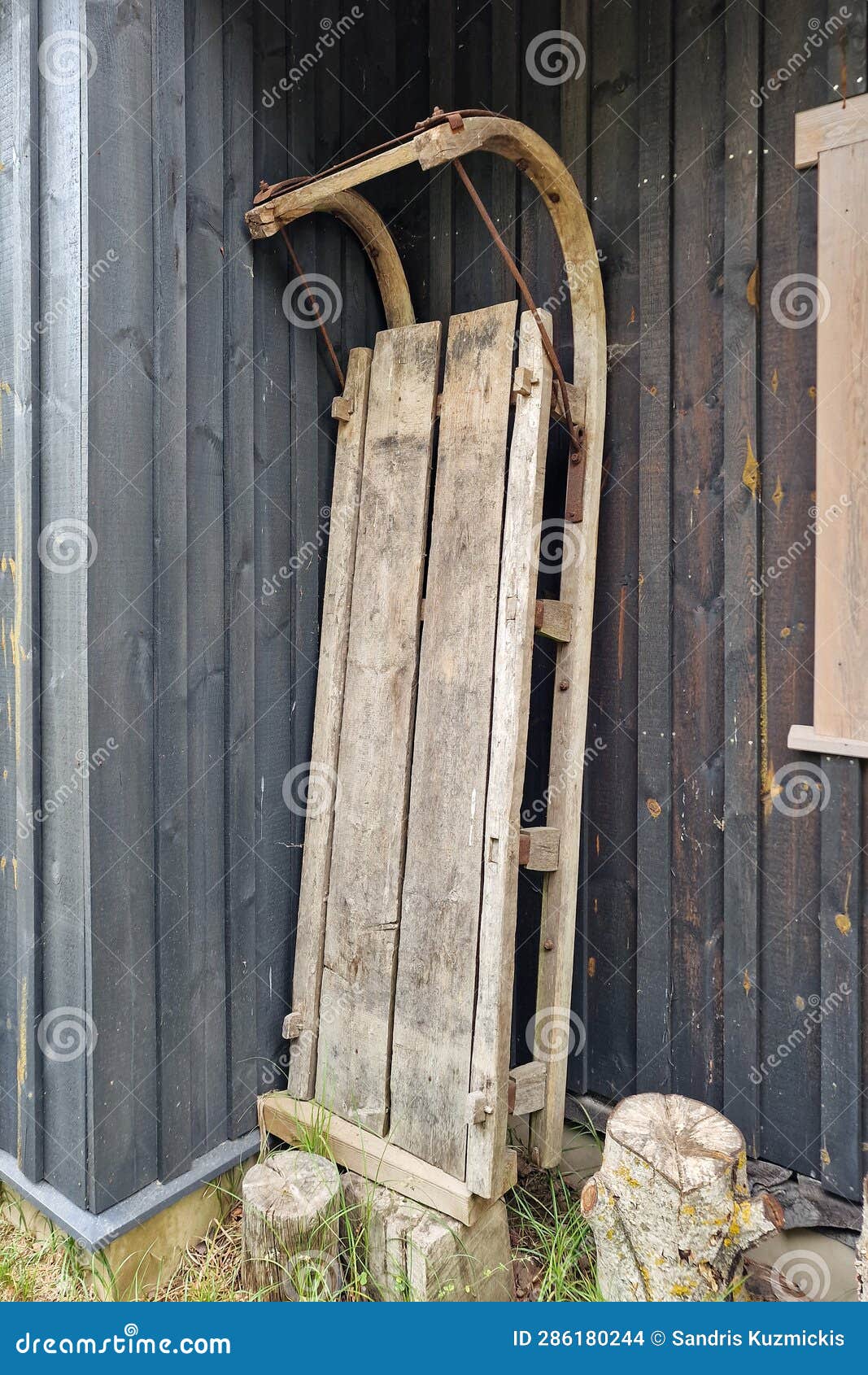 A Large Sledge Against the Wall of the Building Stock Photo - Image of ...
