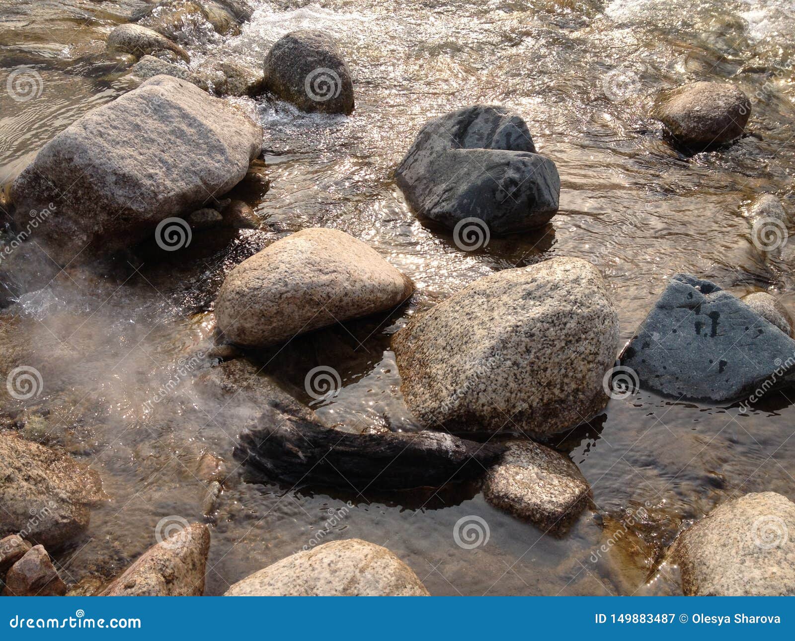 Large and Small Stones of Different Geometric Shapes in the Water ...
