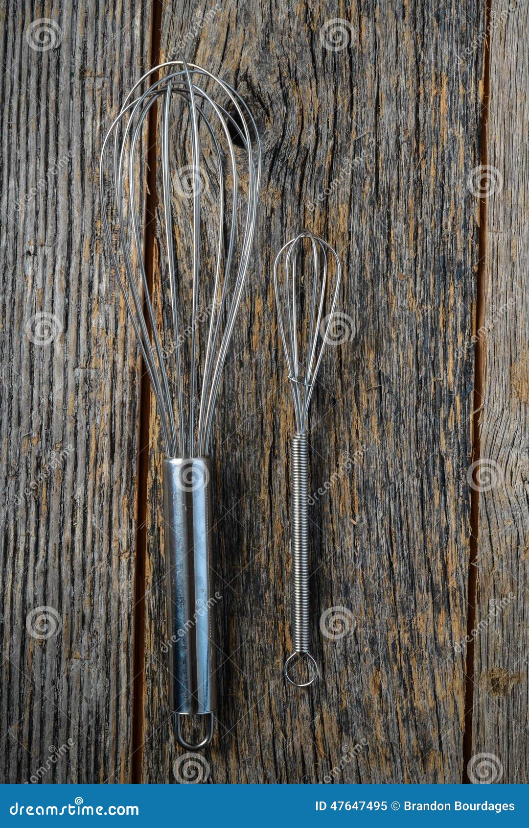 Large and Small Whisk on Rustic Wood Background Stock Image - Image of ...