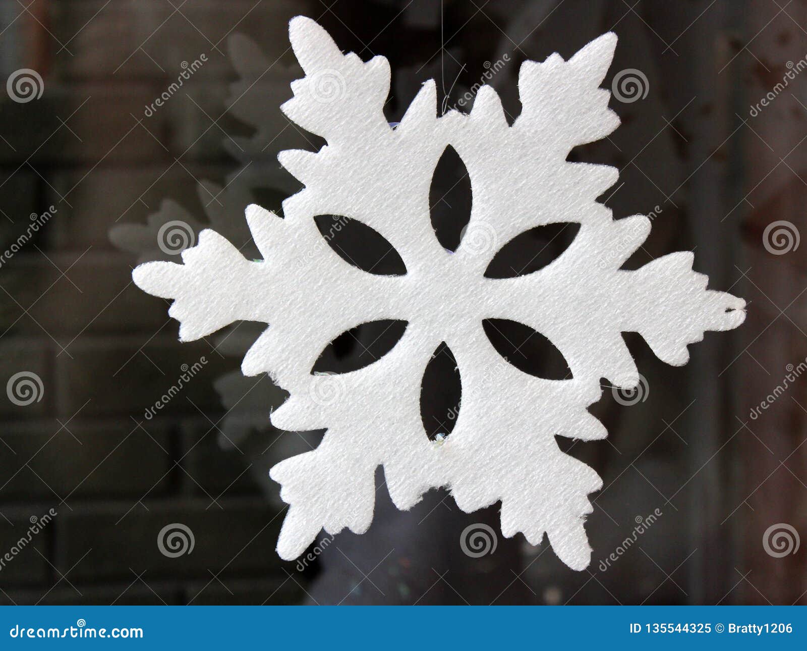 Large Snow Flake Cut from Thick Styrofoam and Hung by Delicate Thread ...