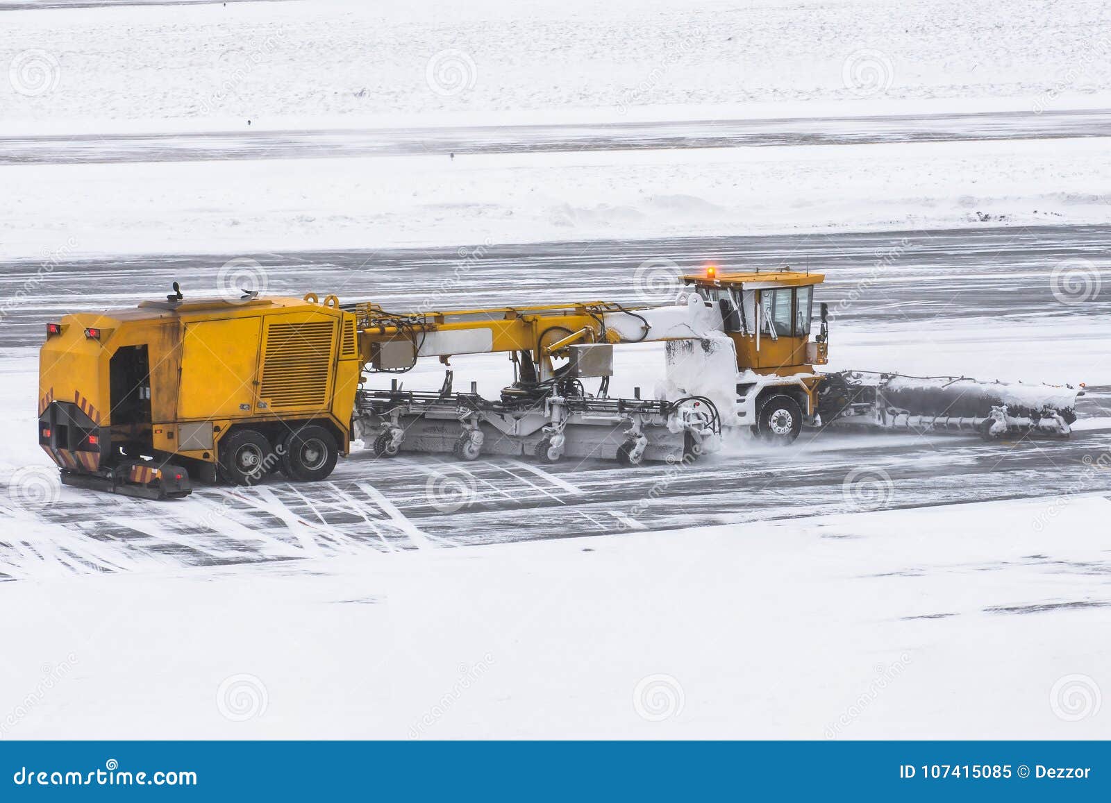 Large Snow Plowing Machine at Work on the Road during a Snow Storm in ...